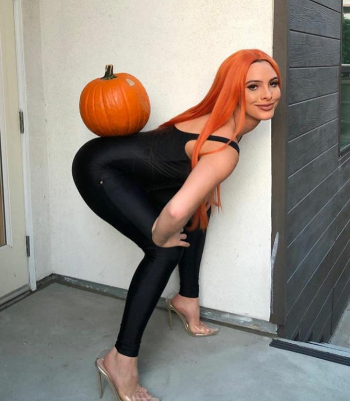 Bending over with pumpkin | Scrolller