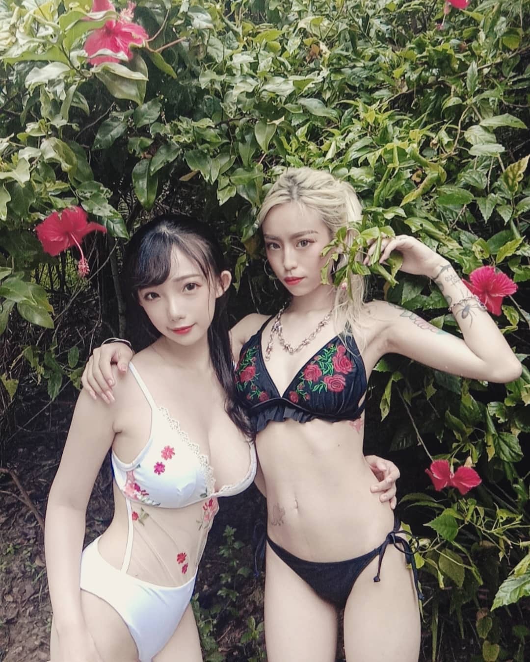 Bikini beauties among the flowers | Scrolller