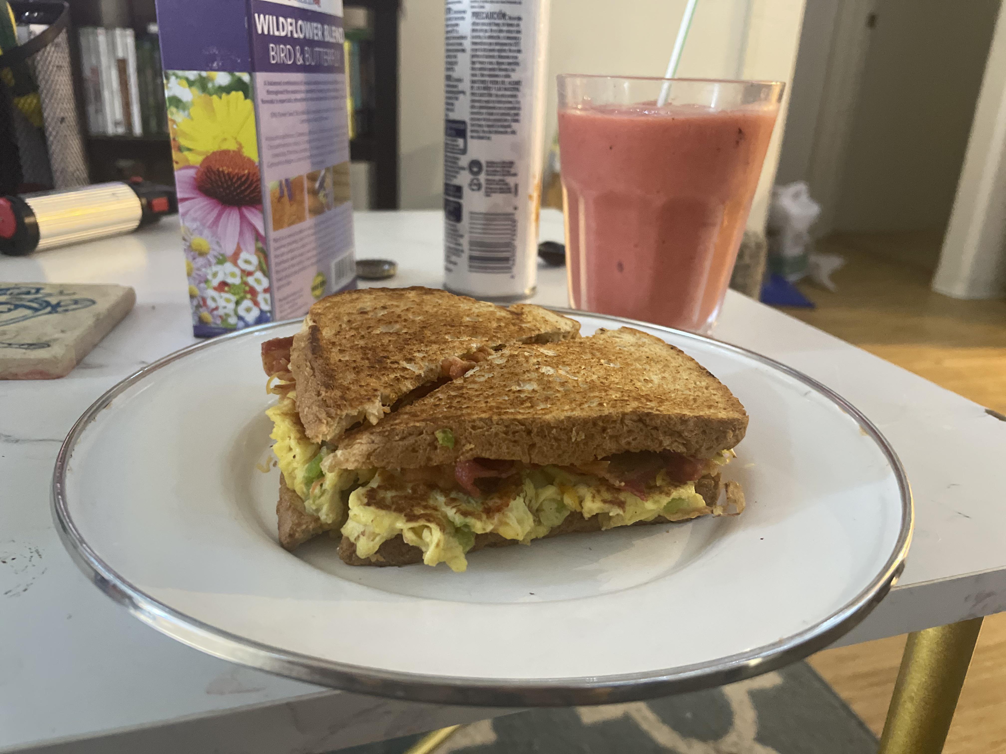 Breakfast sandwich with a strawberry smoothie | Scrolller