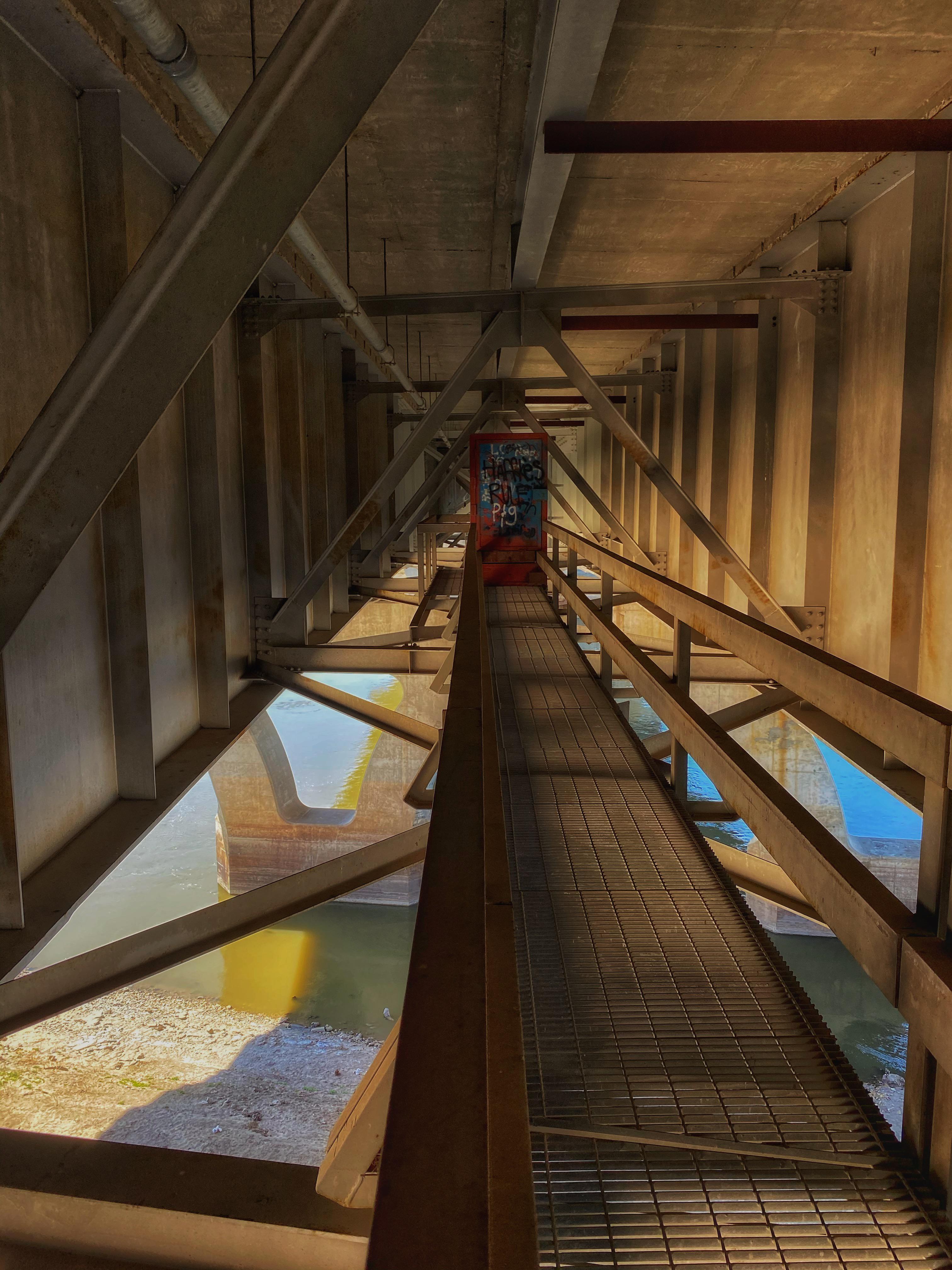 Catwalk under a bridge | Scrolller