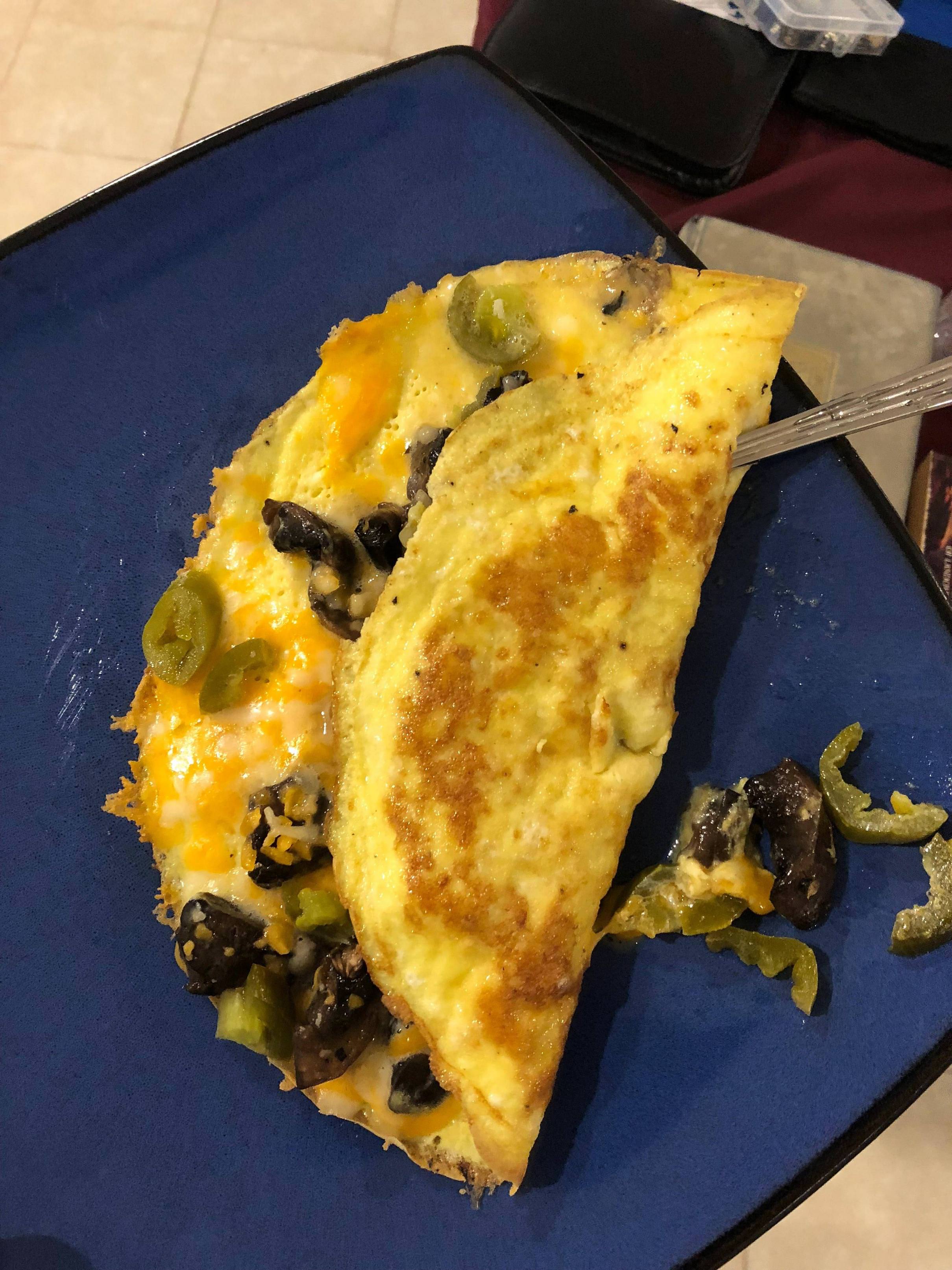 Cheese omelette with mushrooms and jalapeños | Scrolller