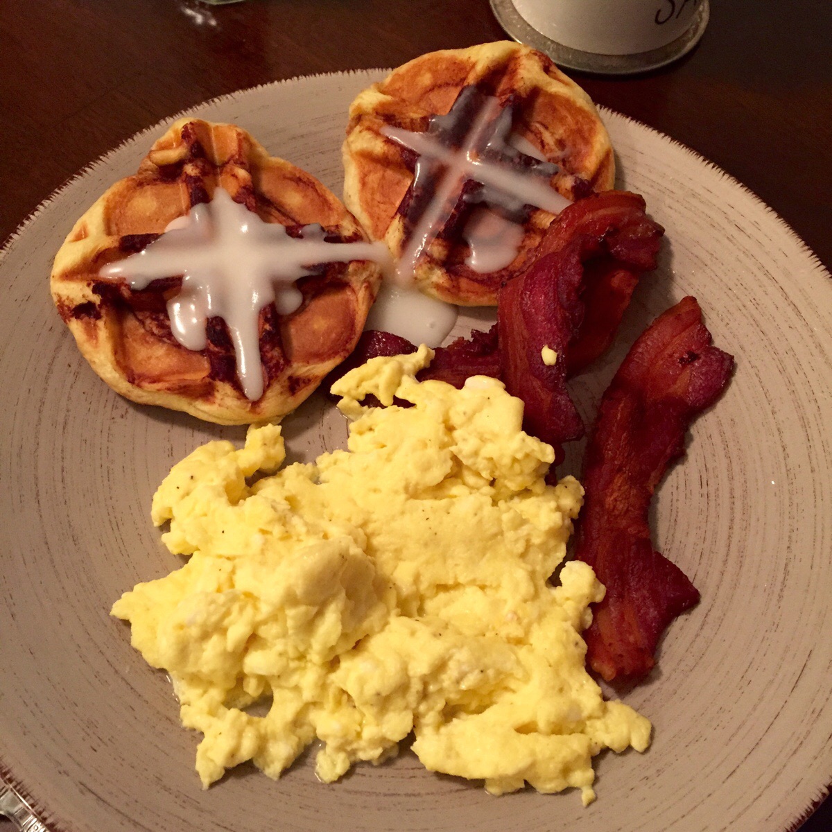 Cinnamon roll waffles, fluffy eggs, and bacon from the local butcher. Breakfast done right ...