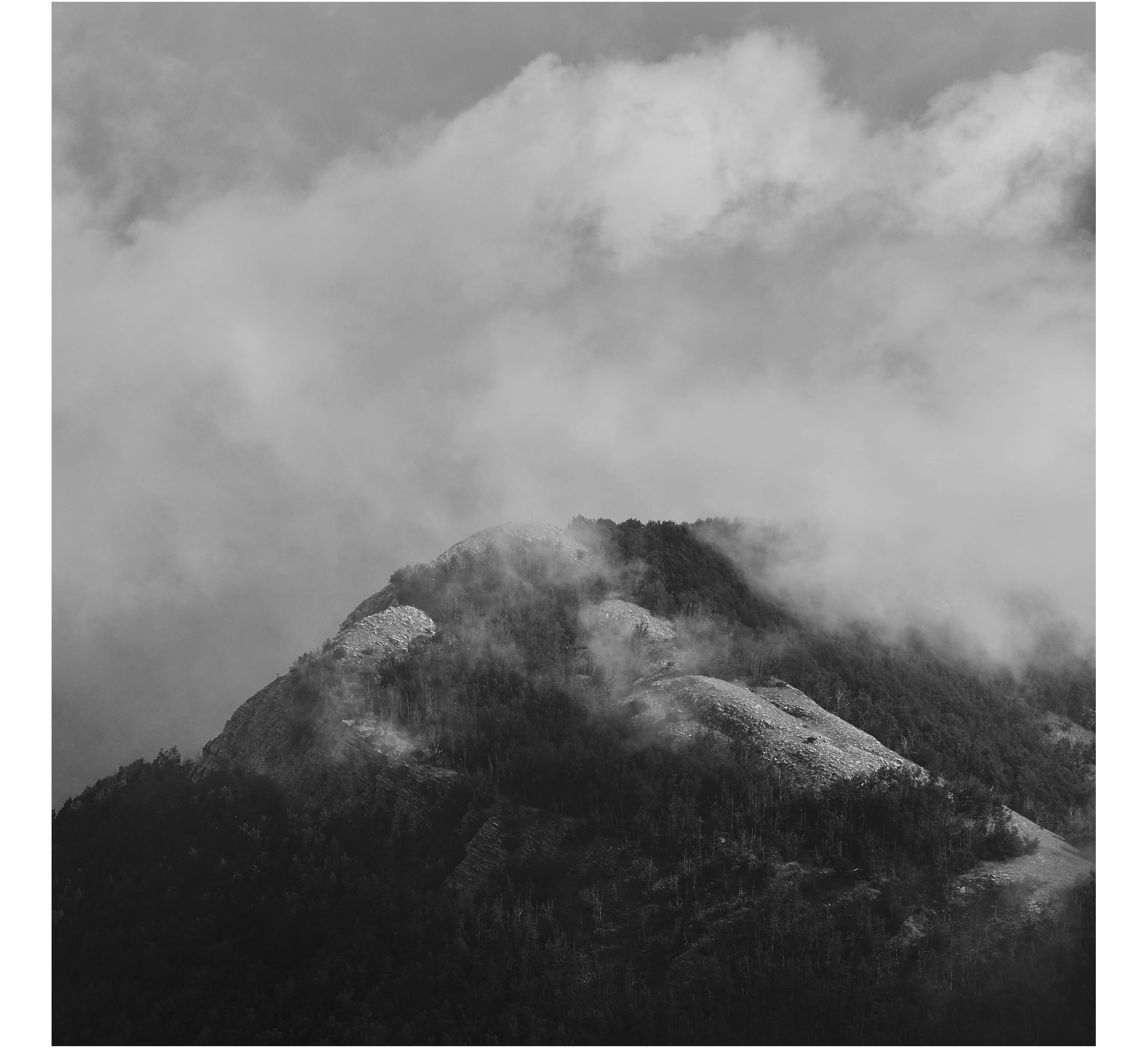 Clouds rolling over a peak, seen from mount Lovcen, Montenegro | Scrolller