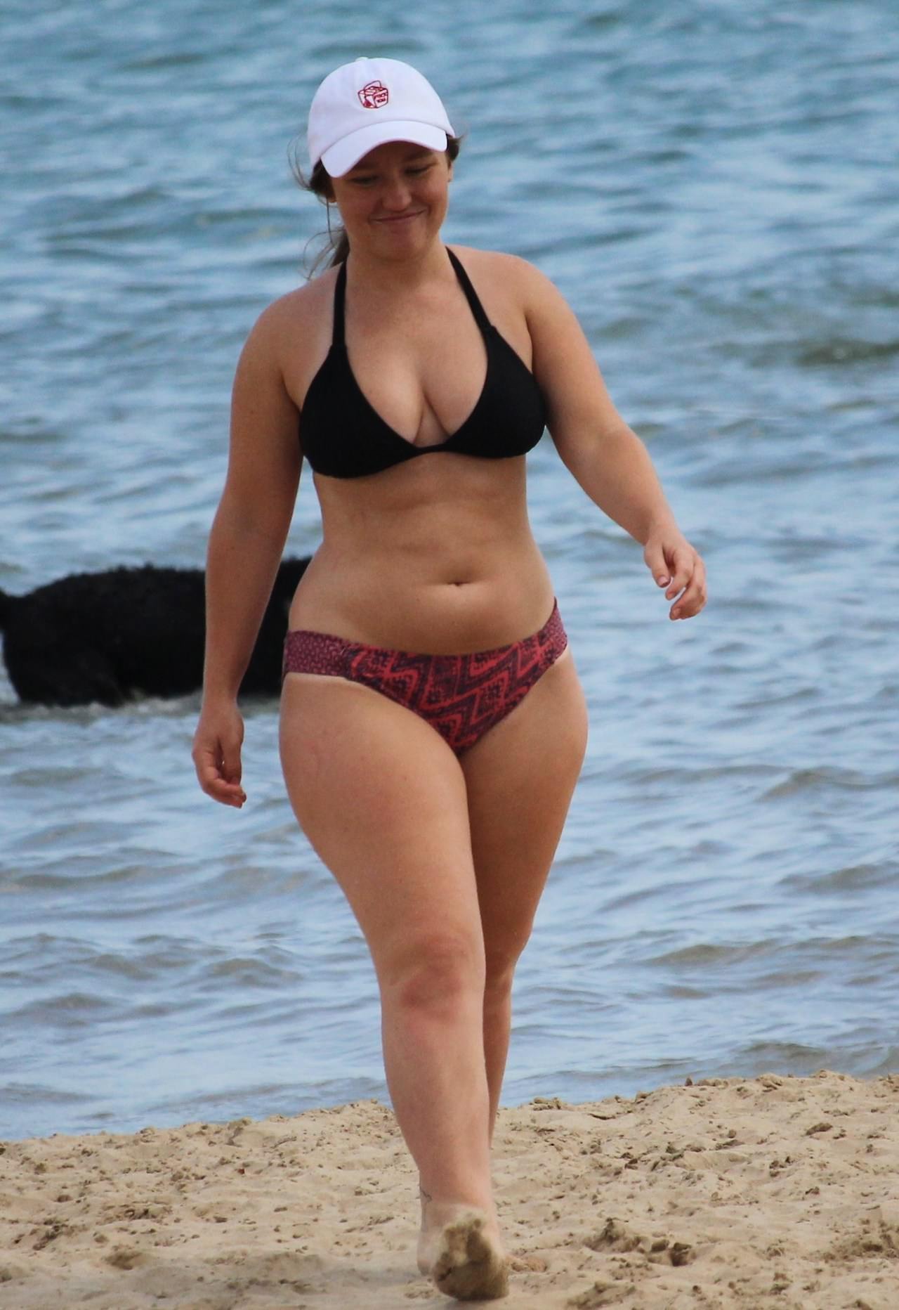 Curvy MILF walking on the beach | Scrolller