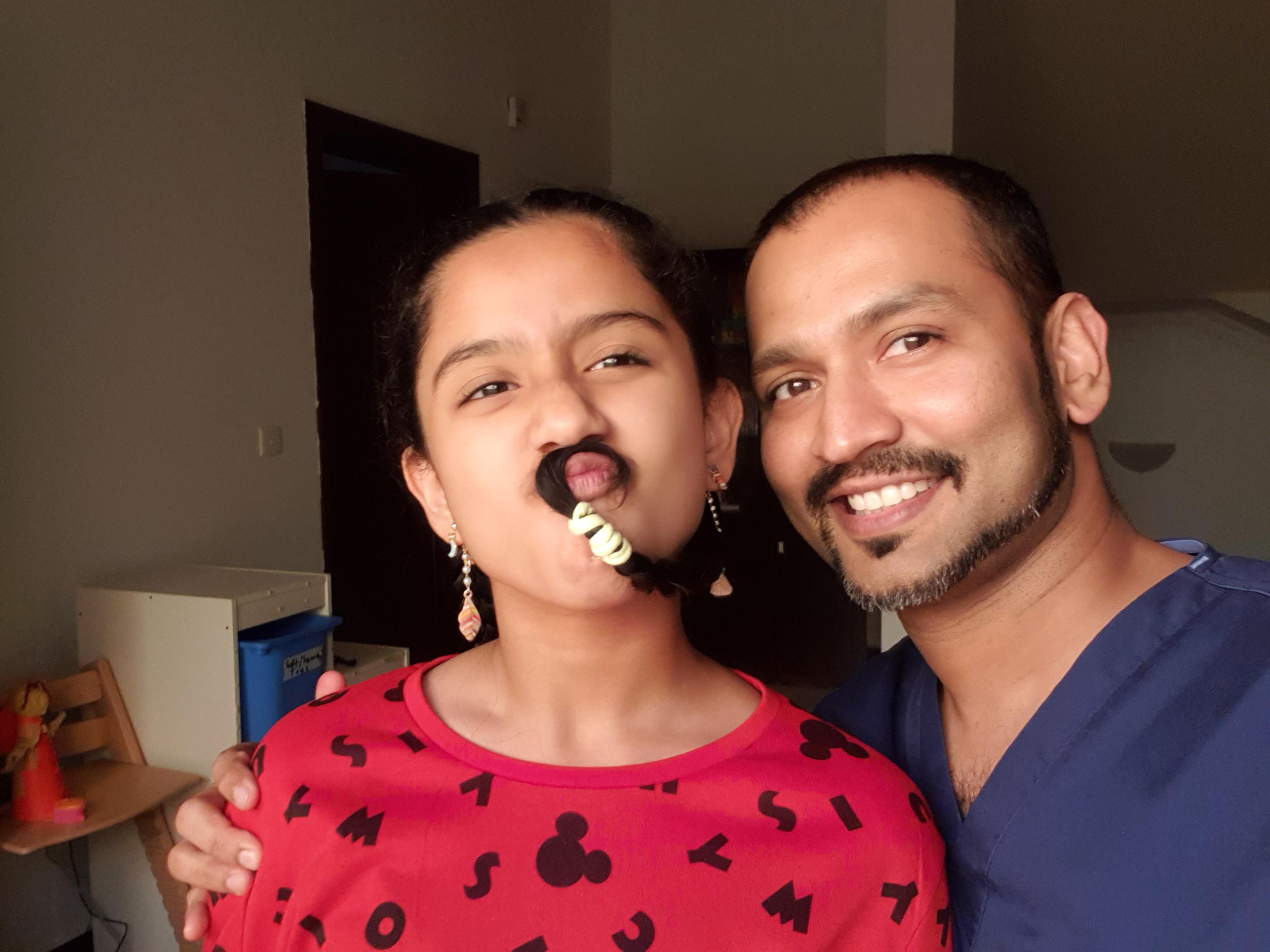 Dad and Daughter with monkey tail beard | Scrolller