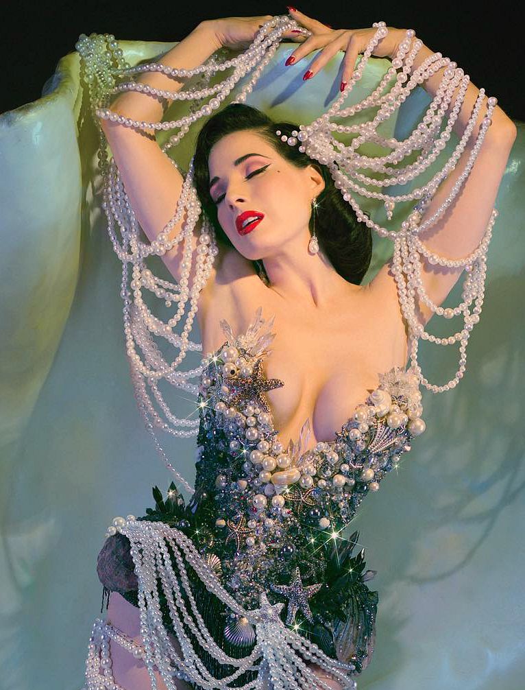 Dita Von Teese draped in pearls during Under The Sea burlesque routine | Scrolller