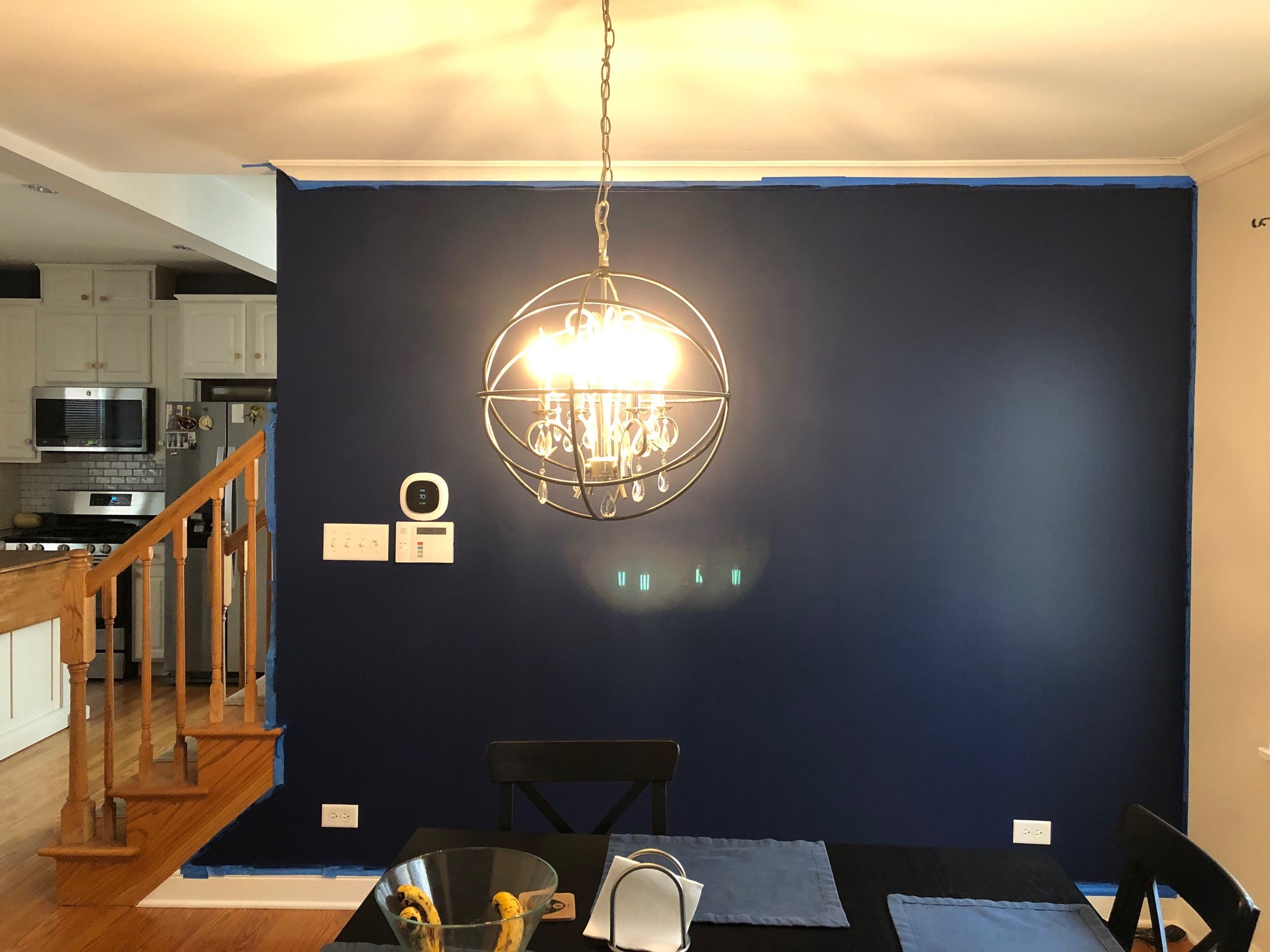 Do I center a mirror/picture relative to the whole wall, or between the light switch/thermostat ...