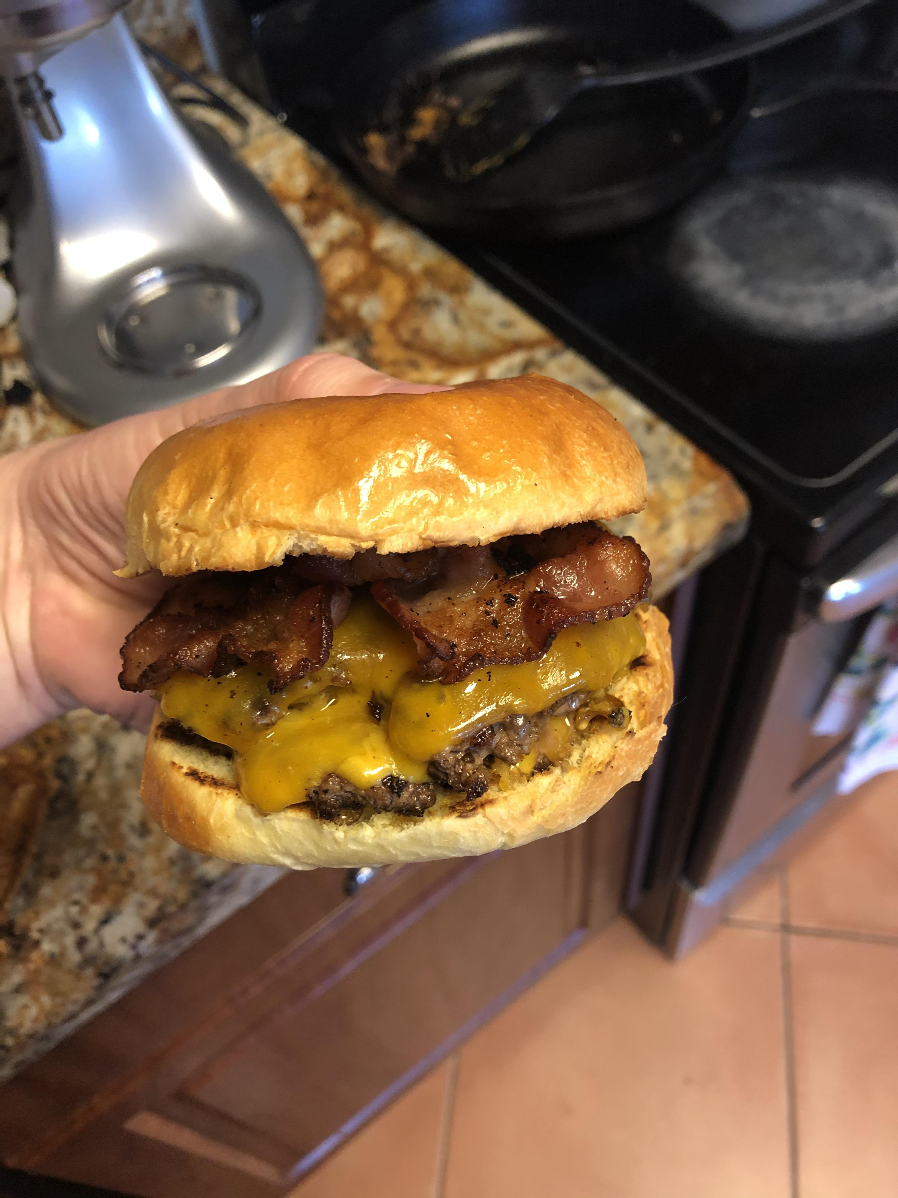Double smash burger with cheddar and bacon on brioche buns. | Scrolller