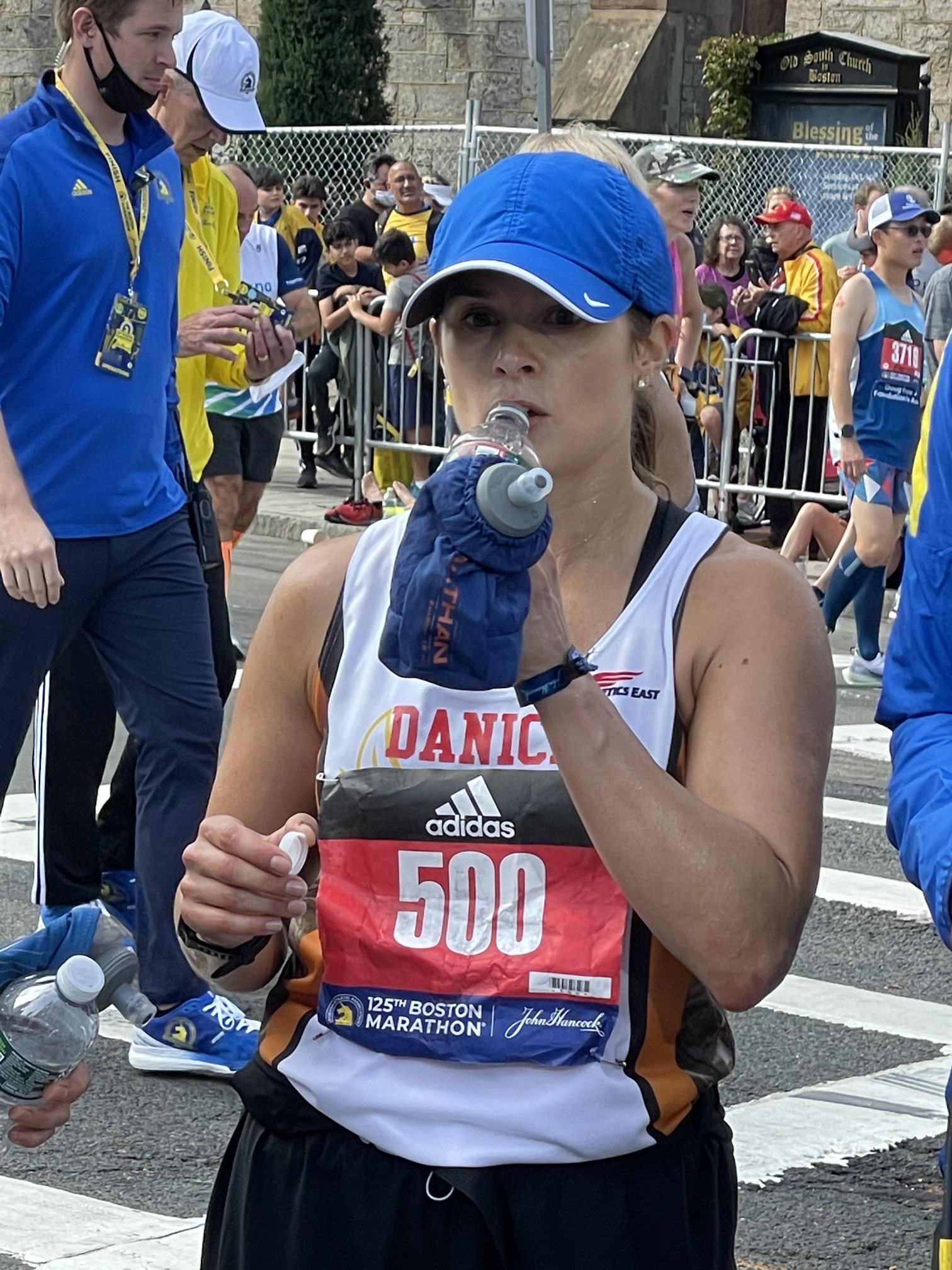 drinking a bottle of water after finishing her 1st Marathon | Scrolller