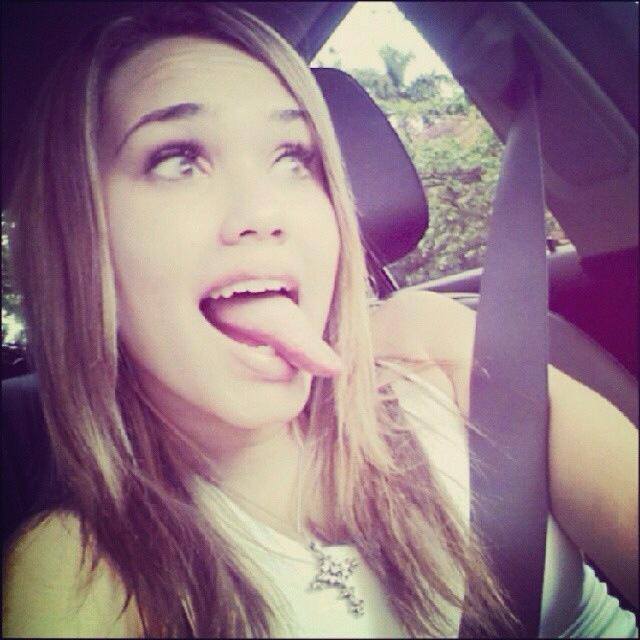 Driving with her tongue out | Scrolller