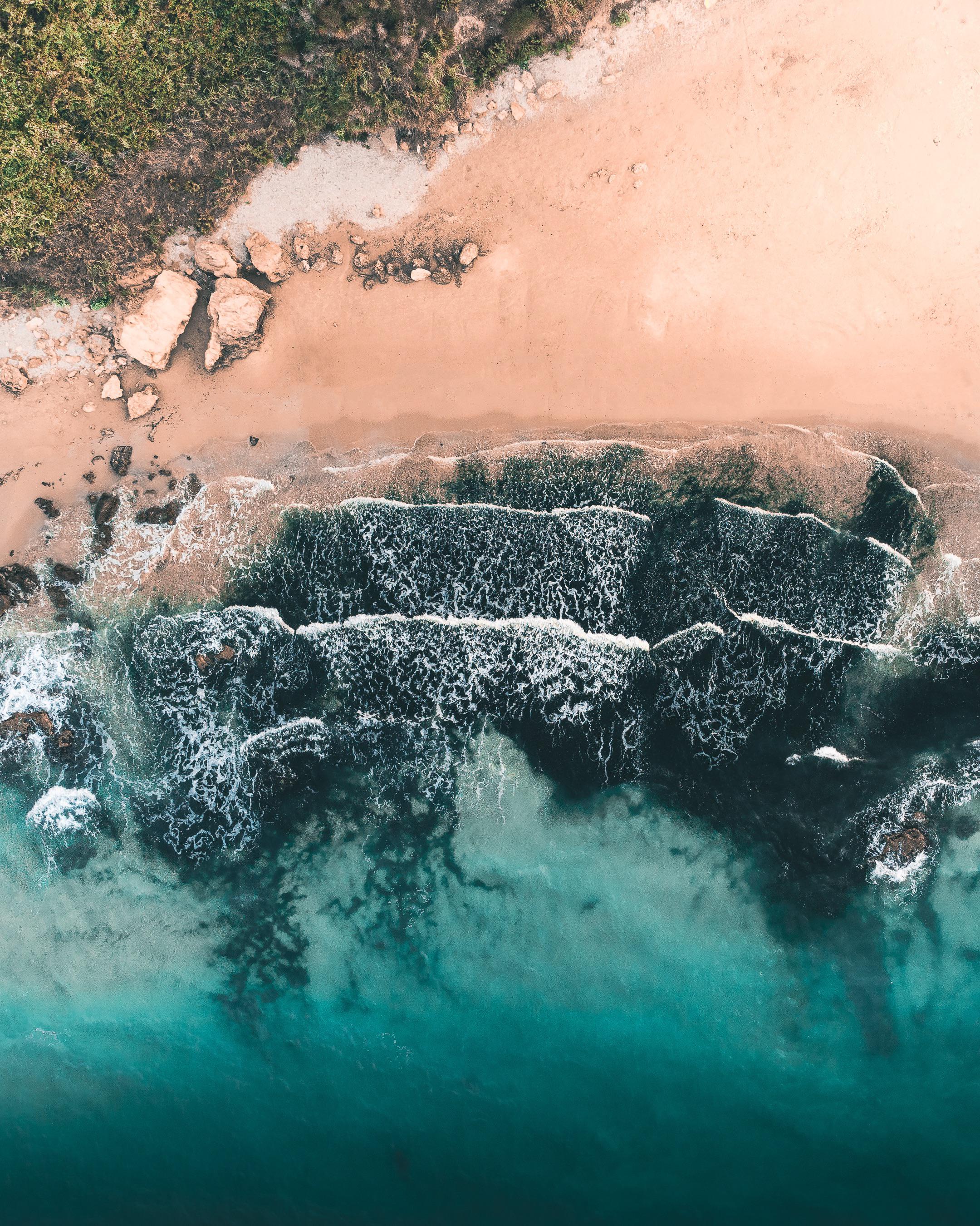 Drone top down of a beach | Scrolller