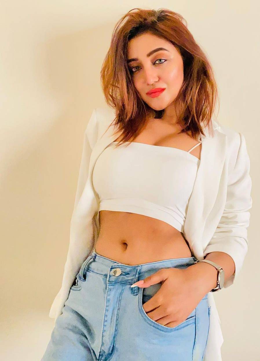 Ena Datta navel in white top, white jacket and denim jeans | Scrolller