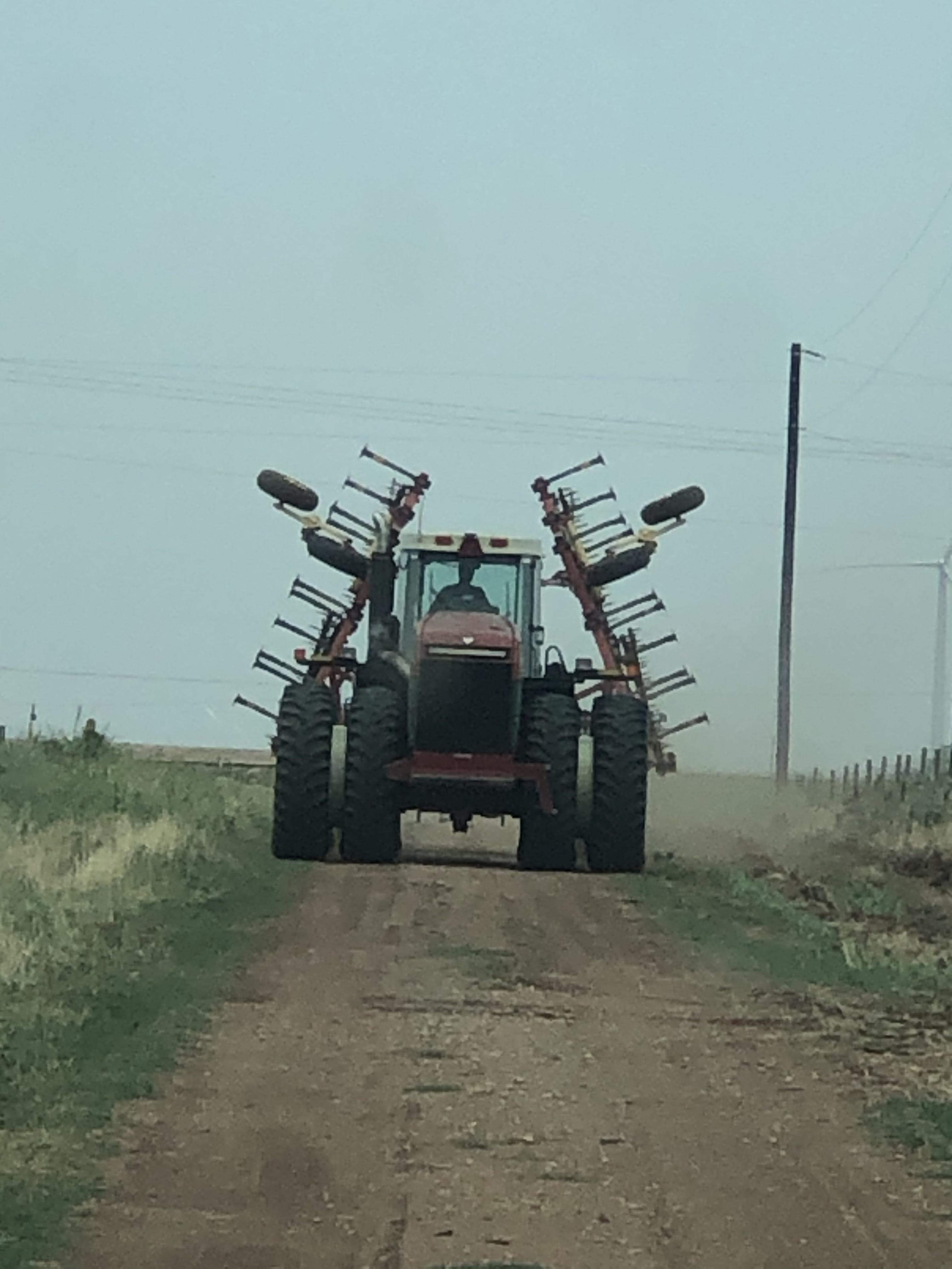 Farmer going down a road | Scrolller