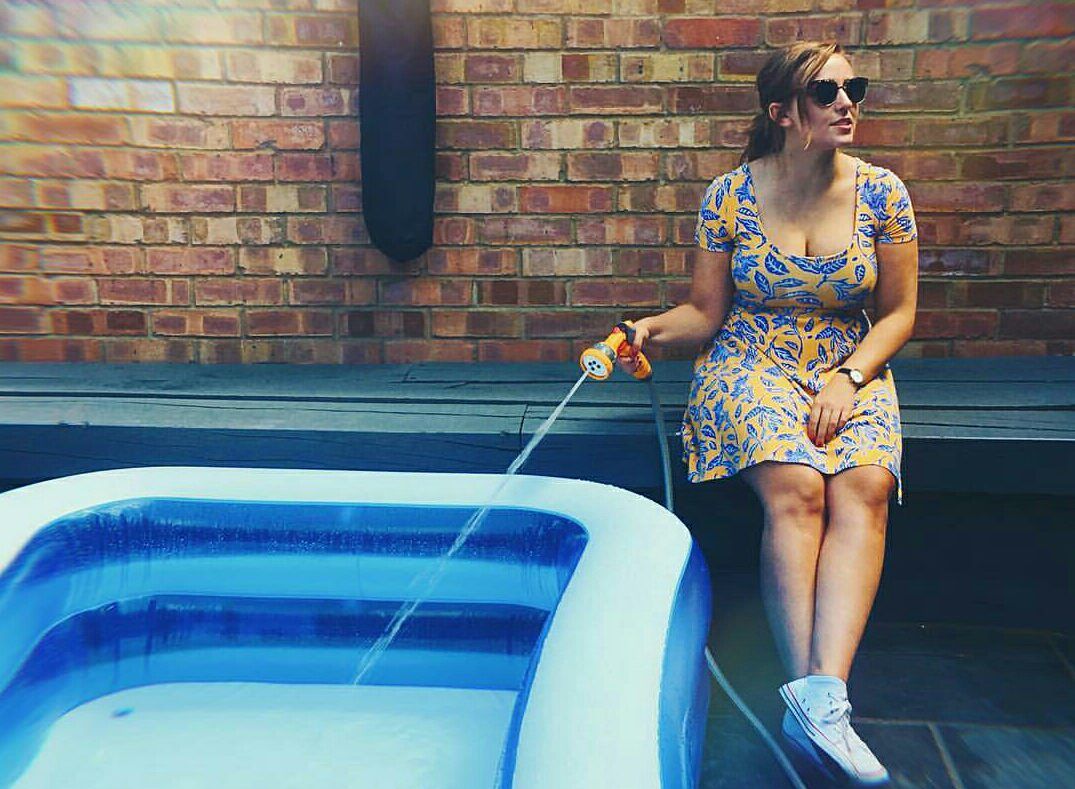 Filling a pool with that cleavage... I mean water. | Scrolller