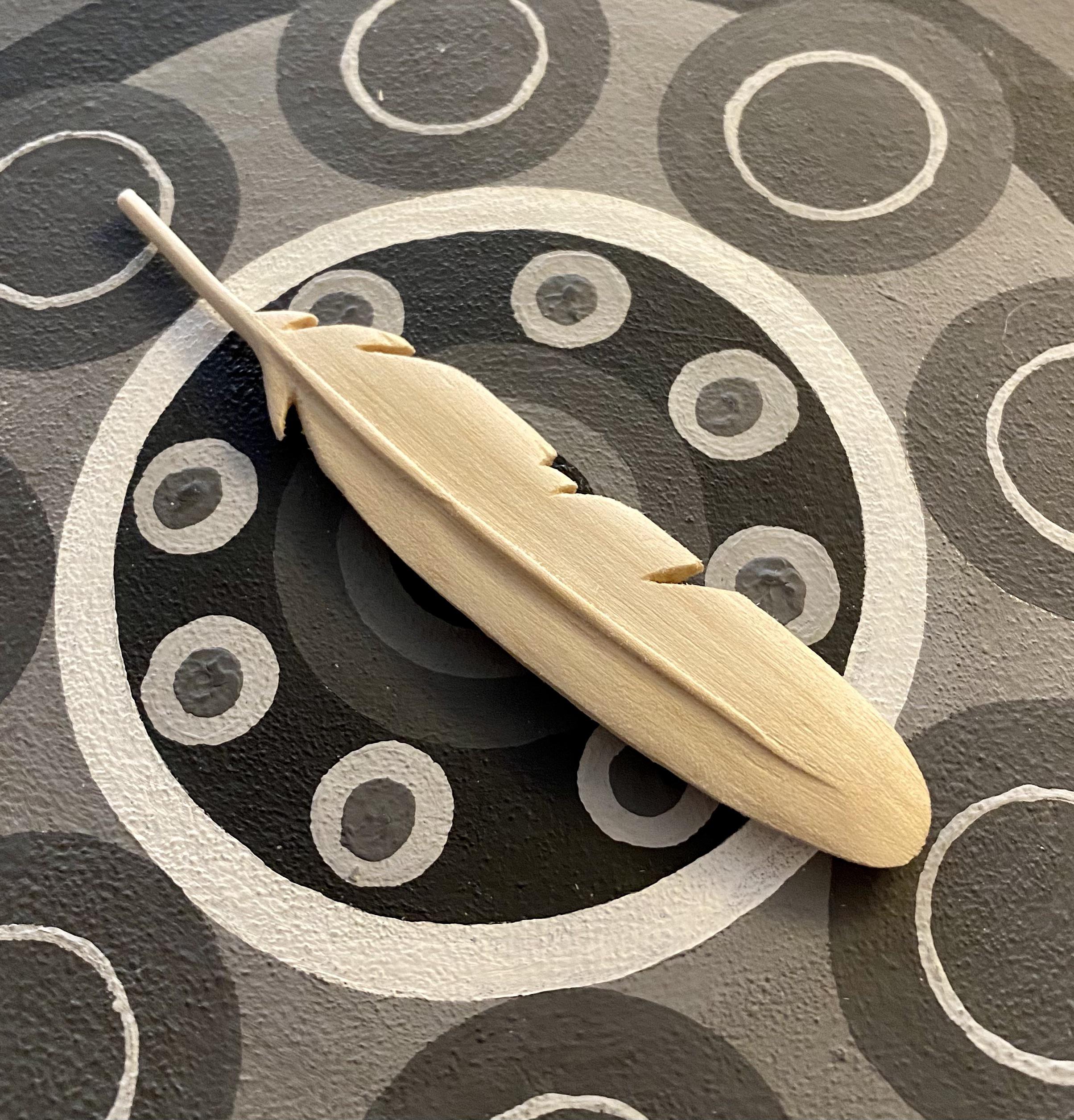 first feather | Scrolller