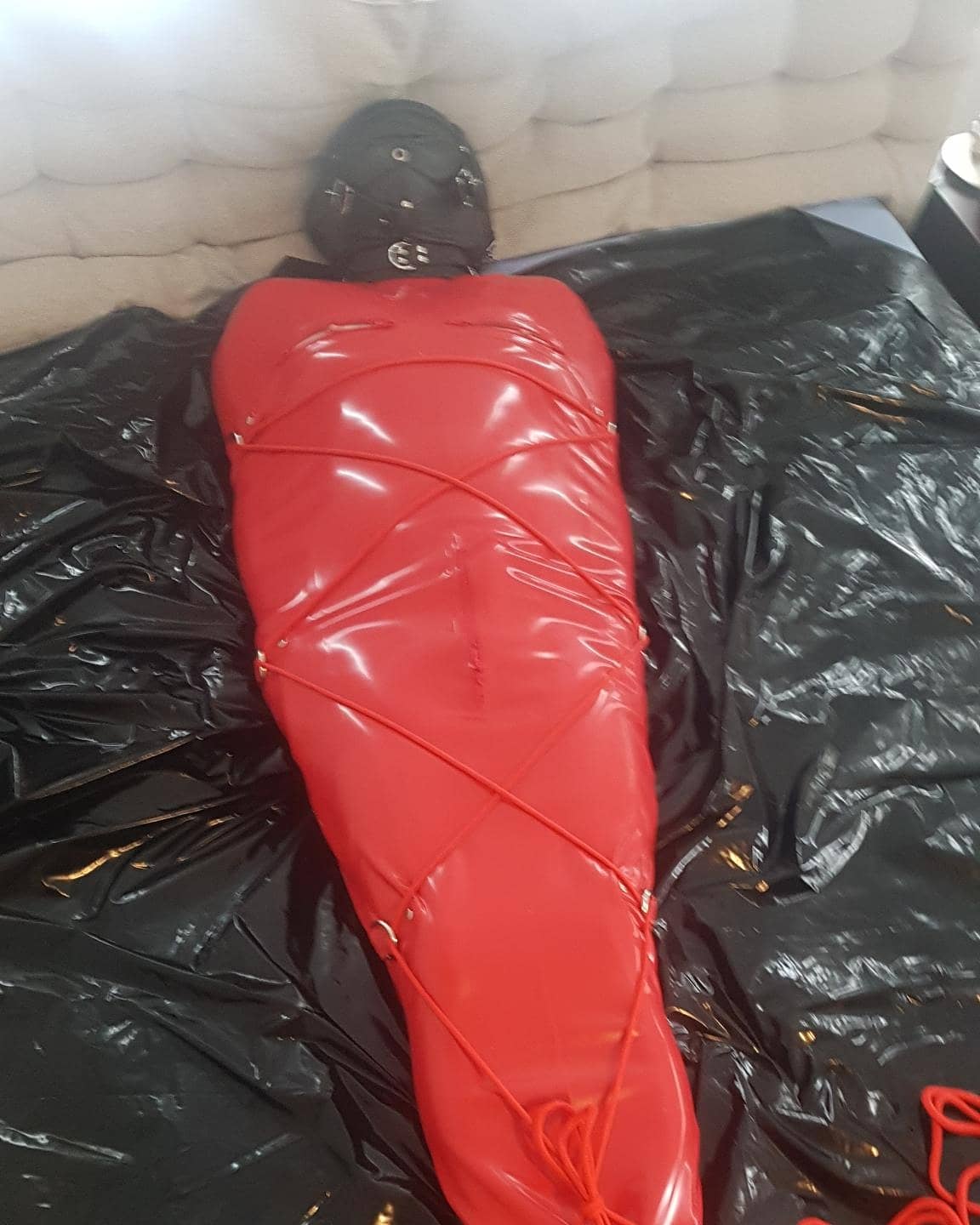 First time in sleep sack and isolation hood. Best experience had so far with bondage and latex ...