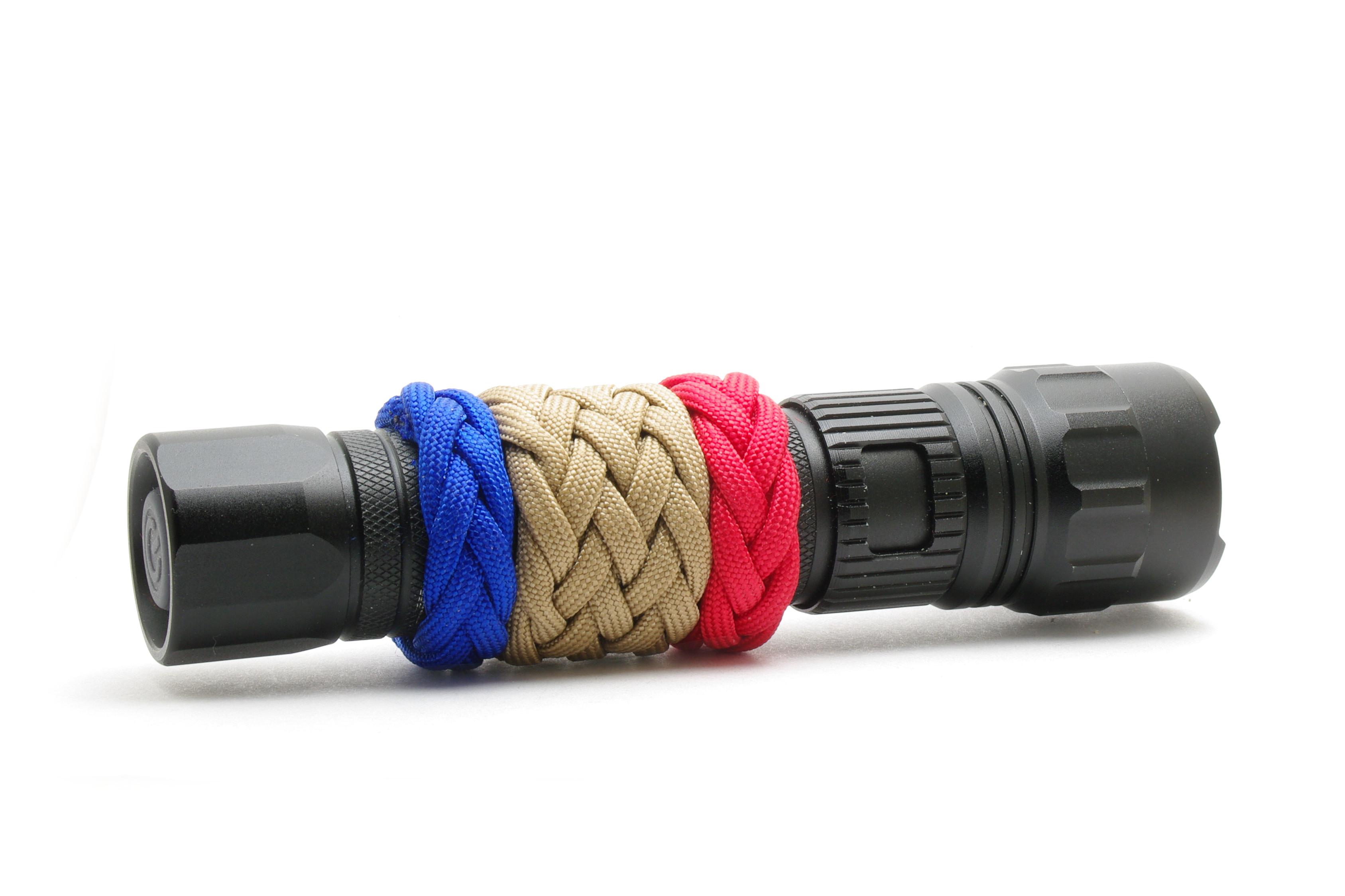 Flashlight wrap using a 9B/11L gaucho flanked by 2 9B/5L ring knots. | Scrolller