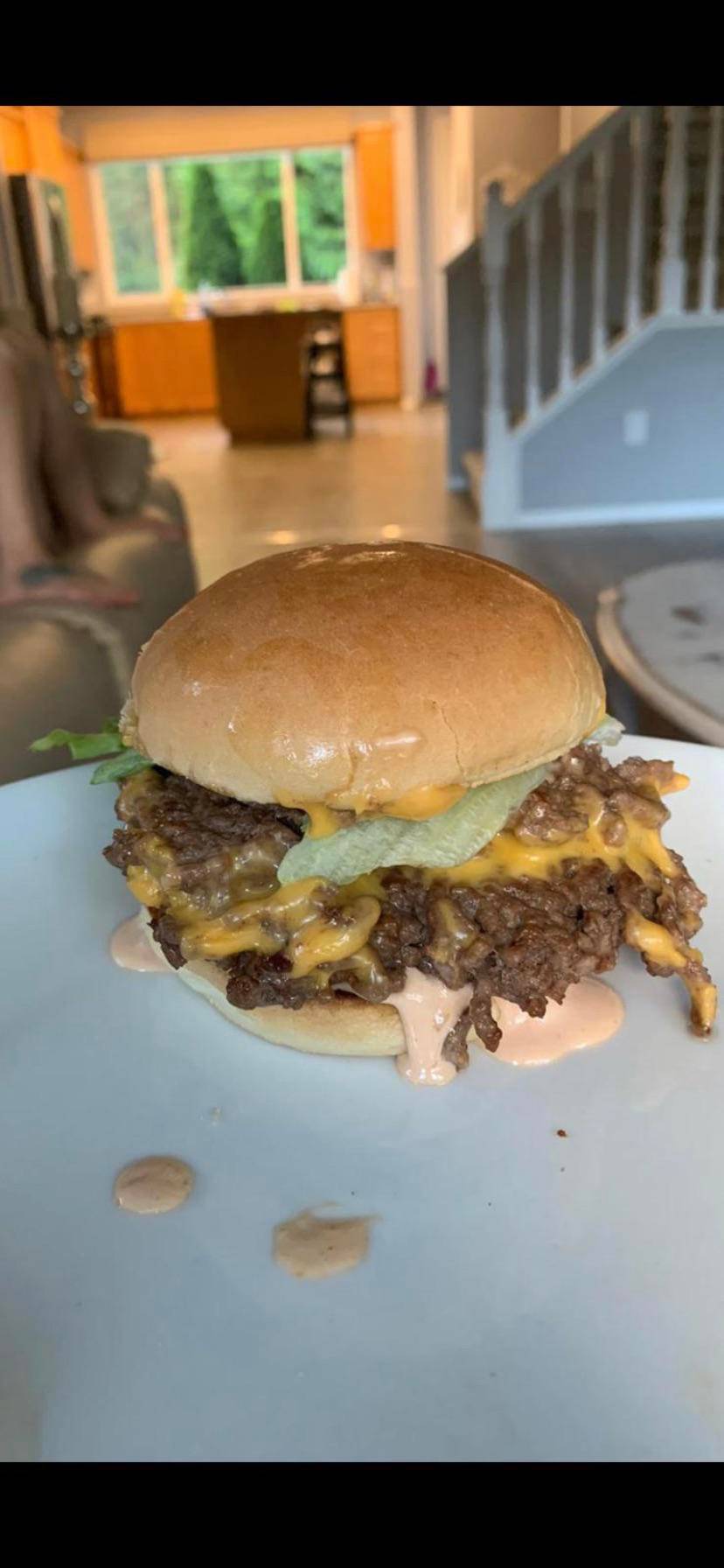 Fresh beef cooked on cast iron flat top, home Made sauce, toasted bun, double cheeseburger ...