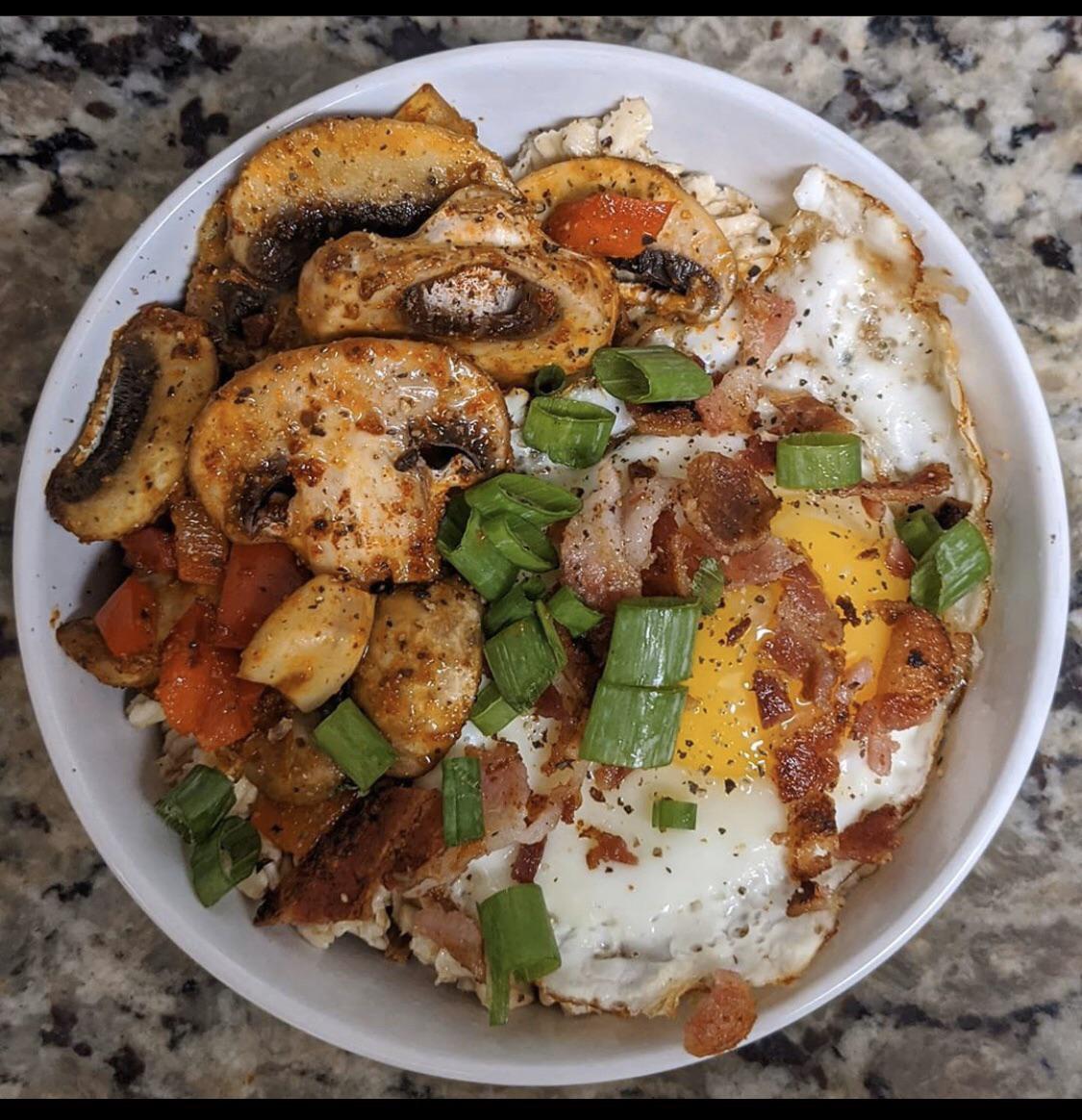 Fried eggs, mushroom, peppers, onions, chopped bacon | Scrolller