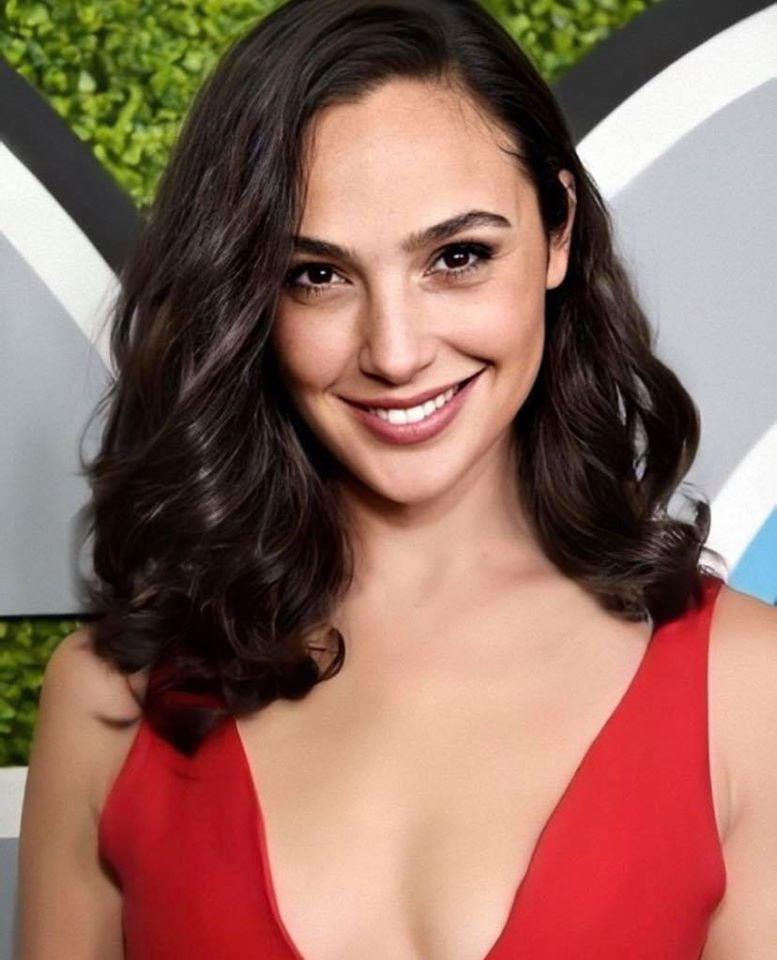 Gal Gadot big smiles in red | Scrolller
