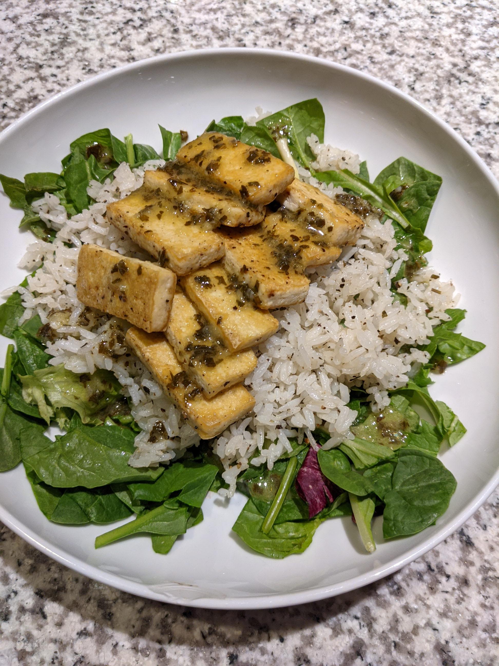 Garlic lemon tofu with white rice and greens | Scrolller