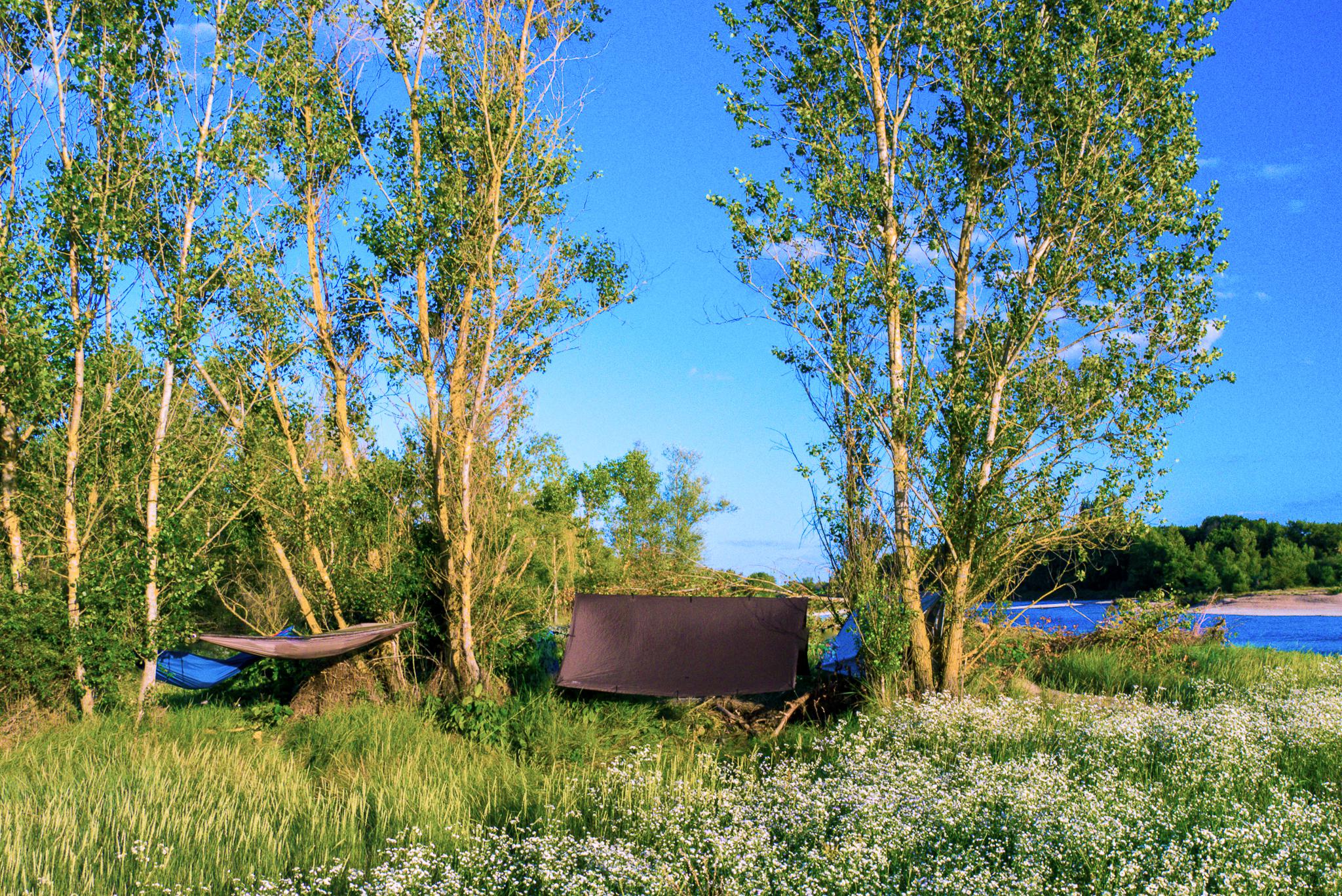 Hammocking with friends on an amazing canoe trip on the French river La Loire. | Scrolller