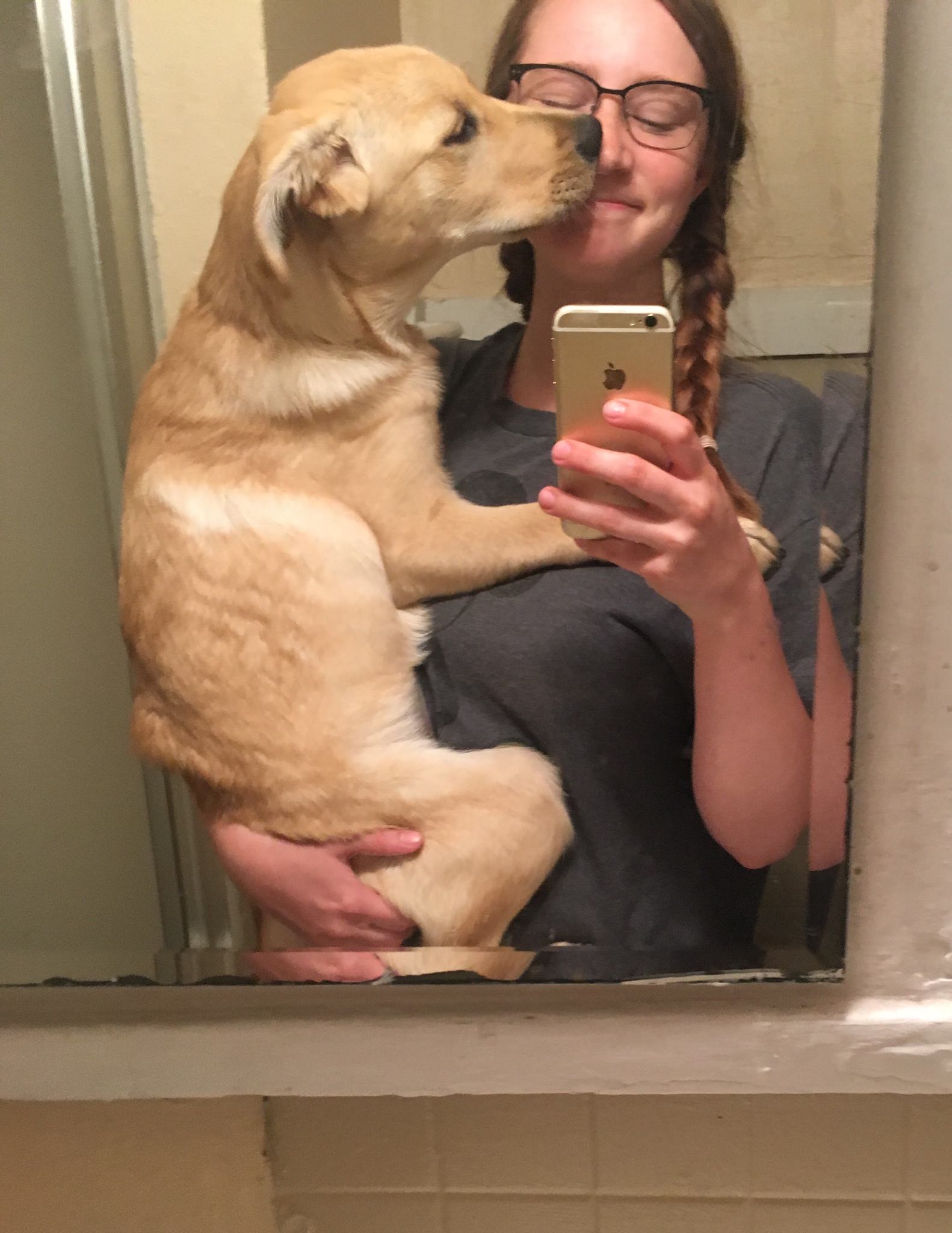 Holding her puppy | Scrolller