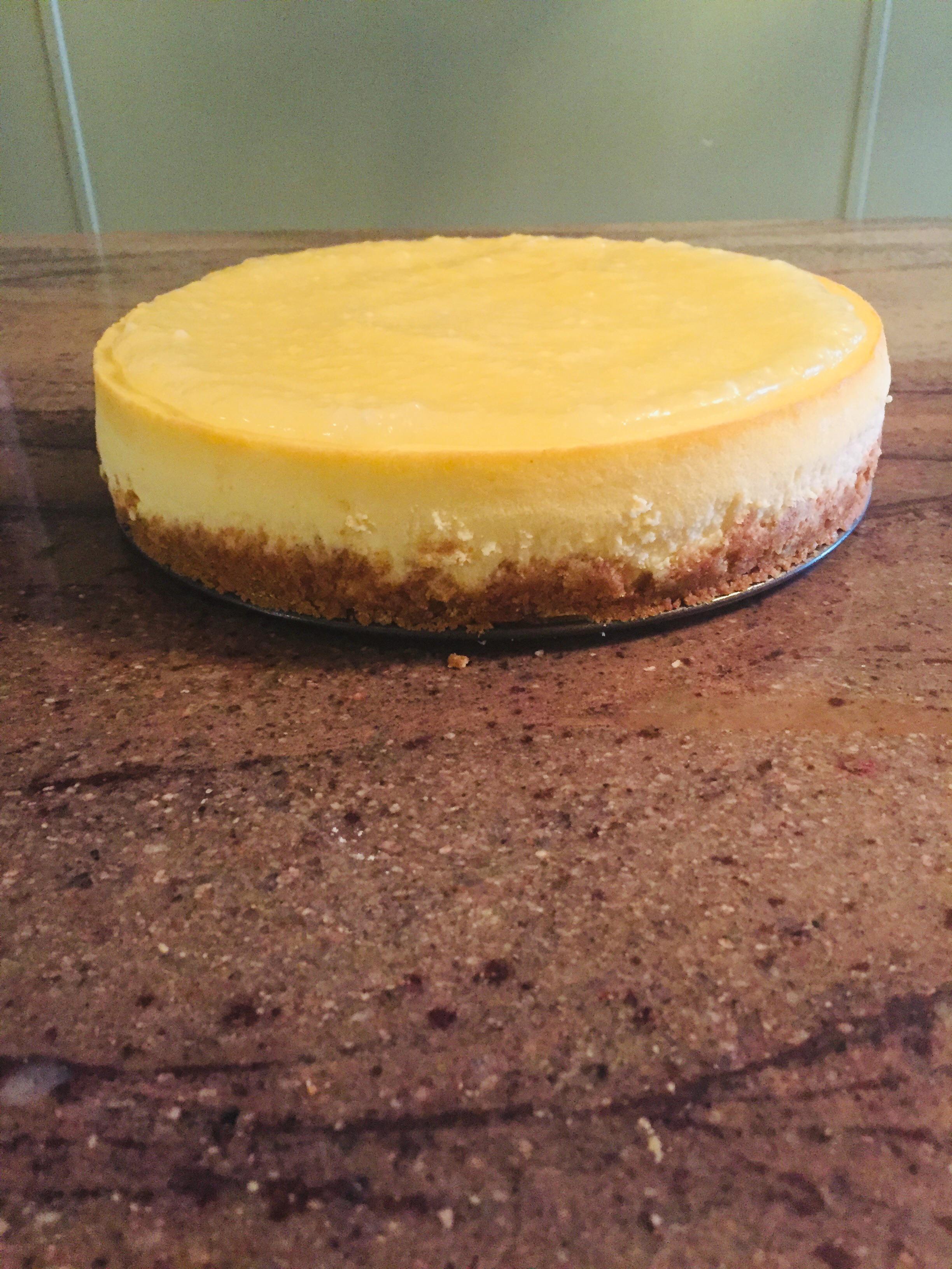 Homemade New York cheesecake with lemon sauce. | Scrolller