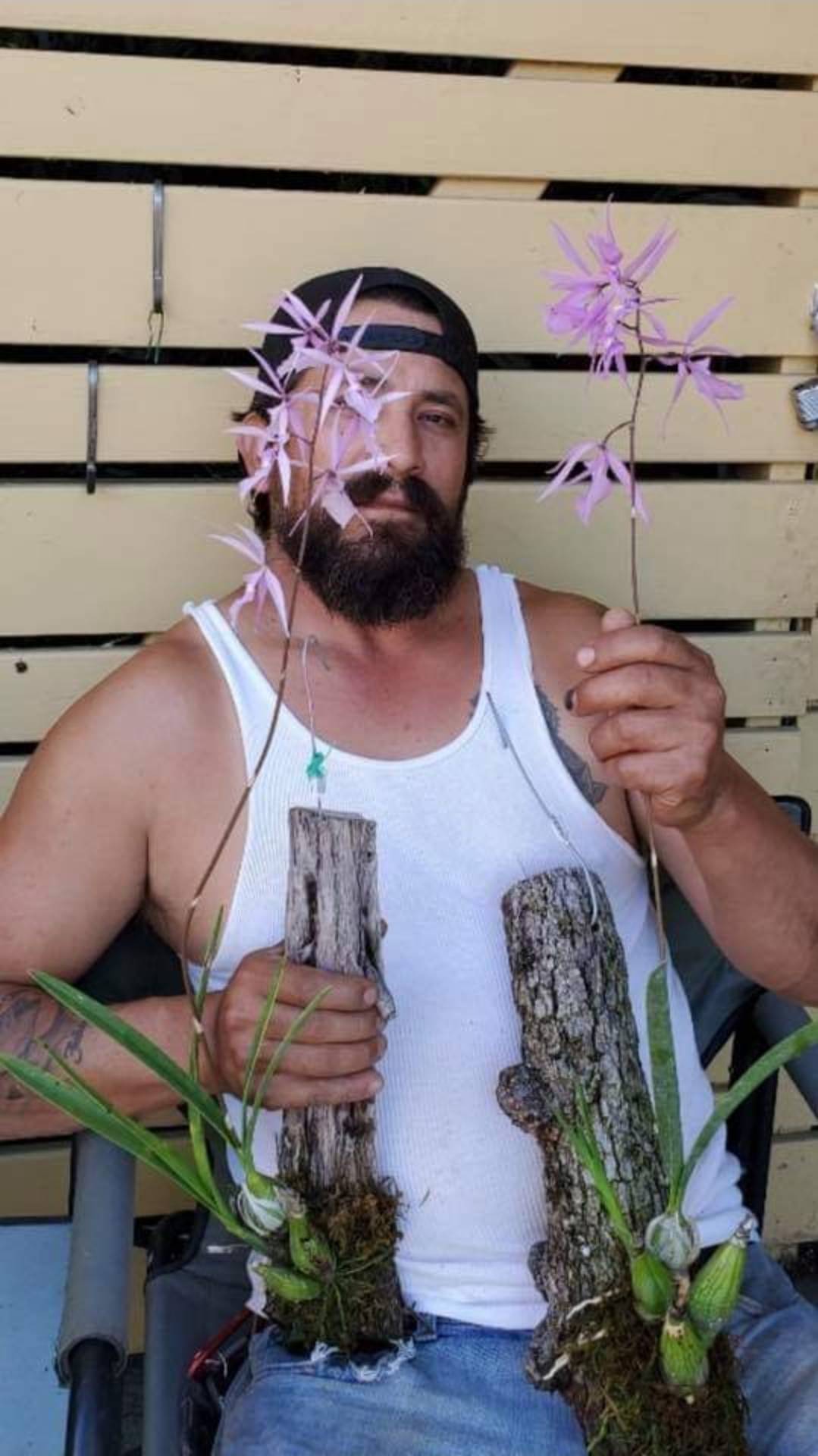 Hot dude with beautiful orchids | Scrolller