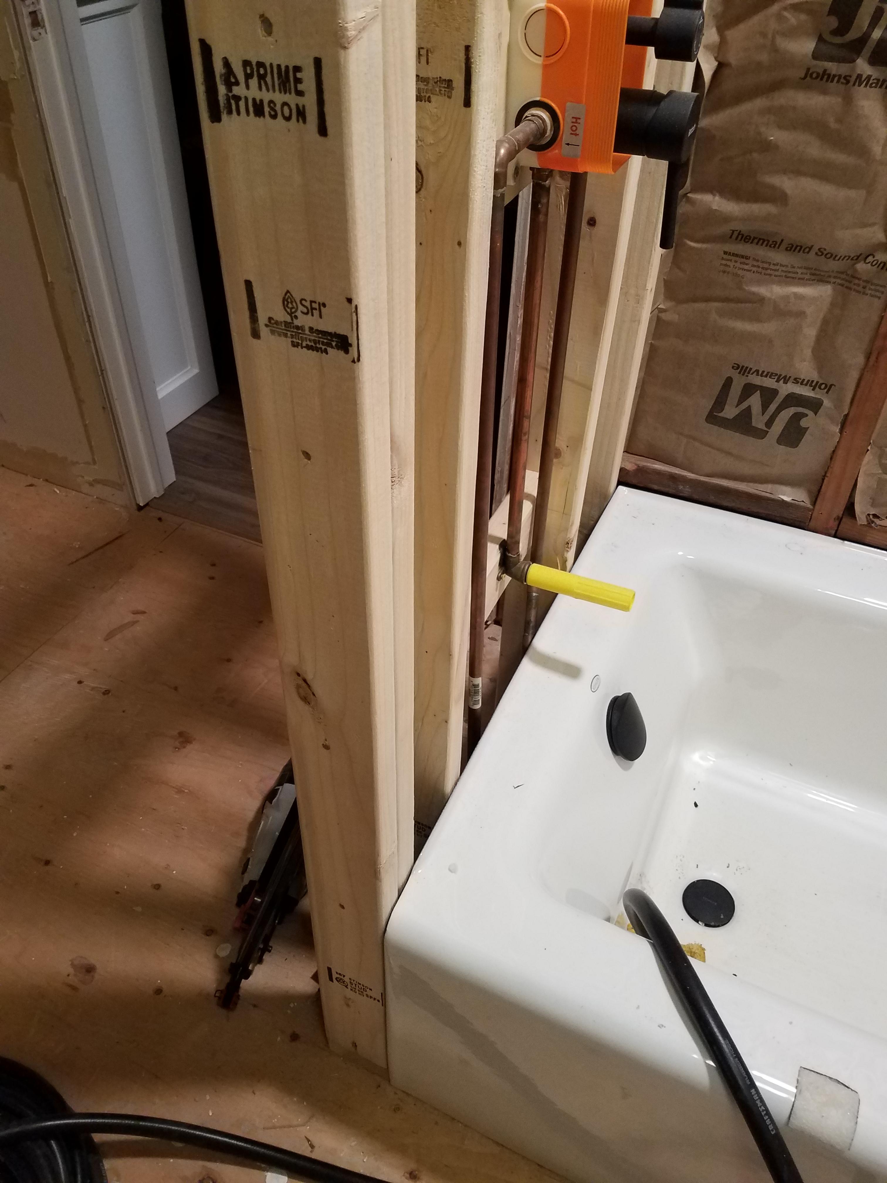 How to finish this outside corner. Tile to drywall. Unsure becuase tub is flush with stud ...