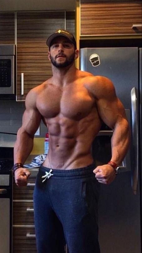 Hunk posing in the kitchen. | Scrolller