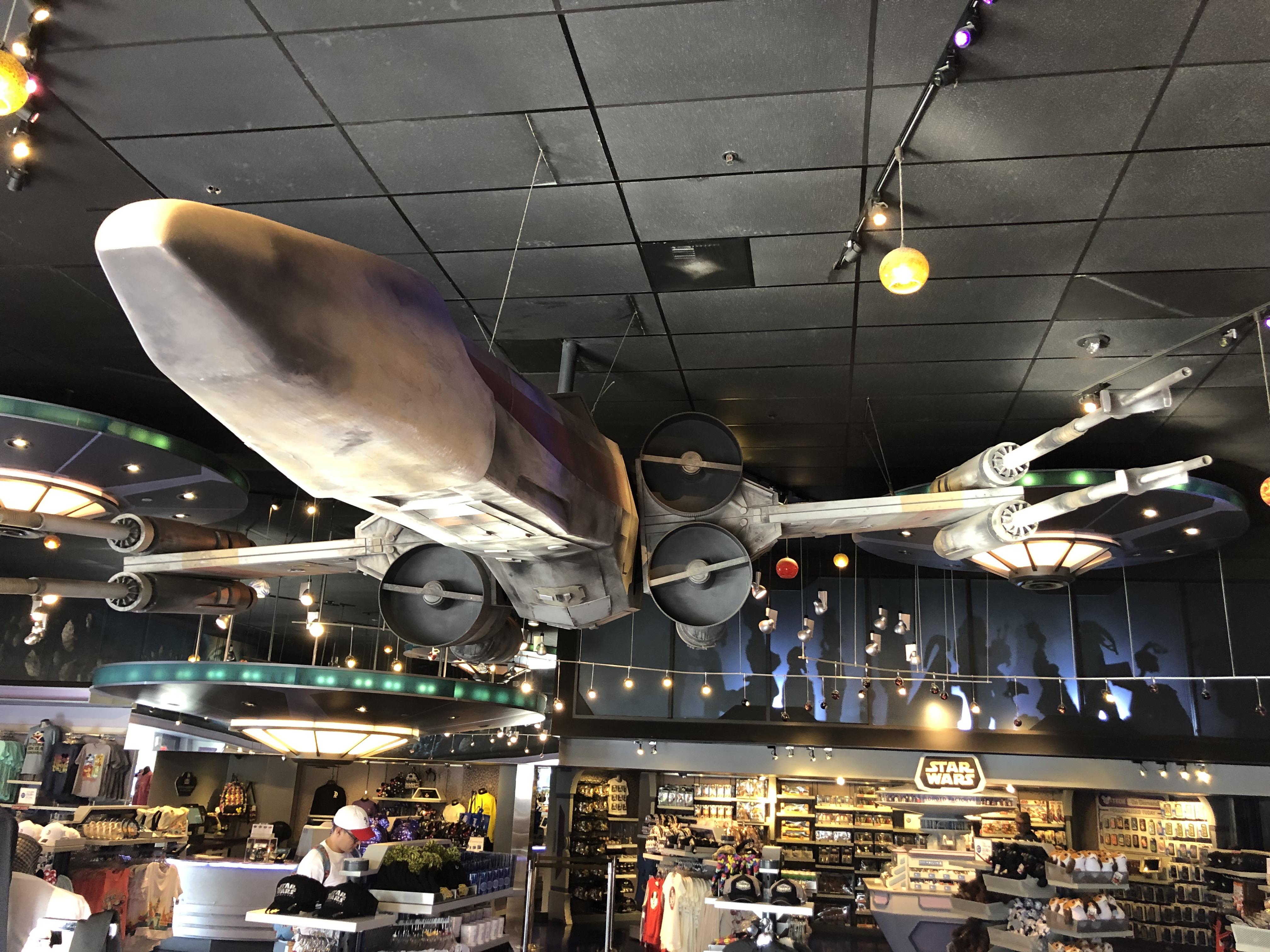 I never noticed the near full sized X-Wing hanging from the ceiling of the Star Trader. | Scrolller