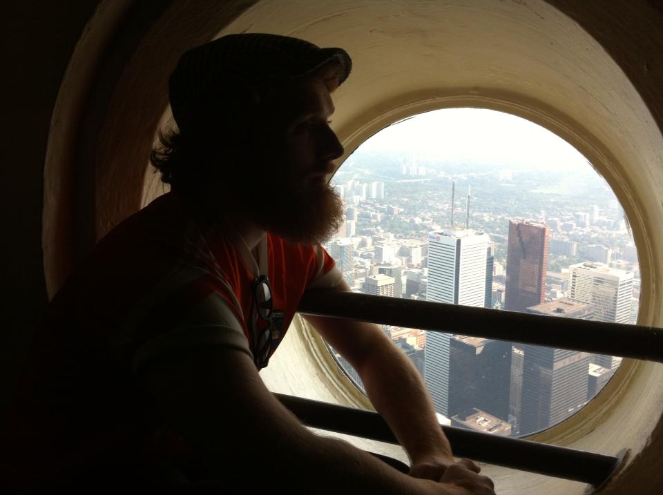 I'm Ross, I'm irish and here's the silhouette of me big red Irish beard up the CN tower. | Scrolller