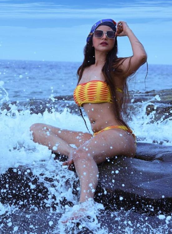 Jolly Bhatia navel in yellow bikini | Scrolller