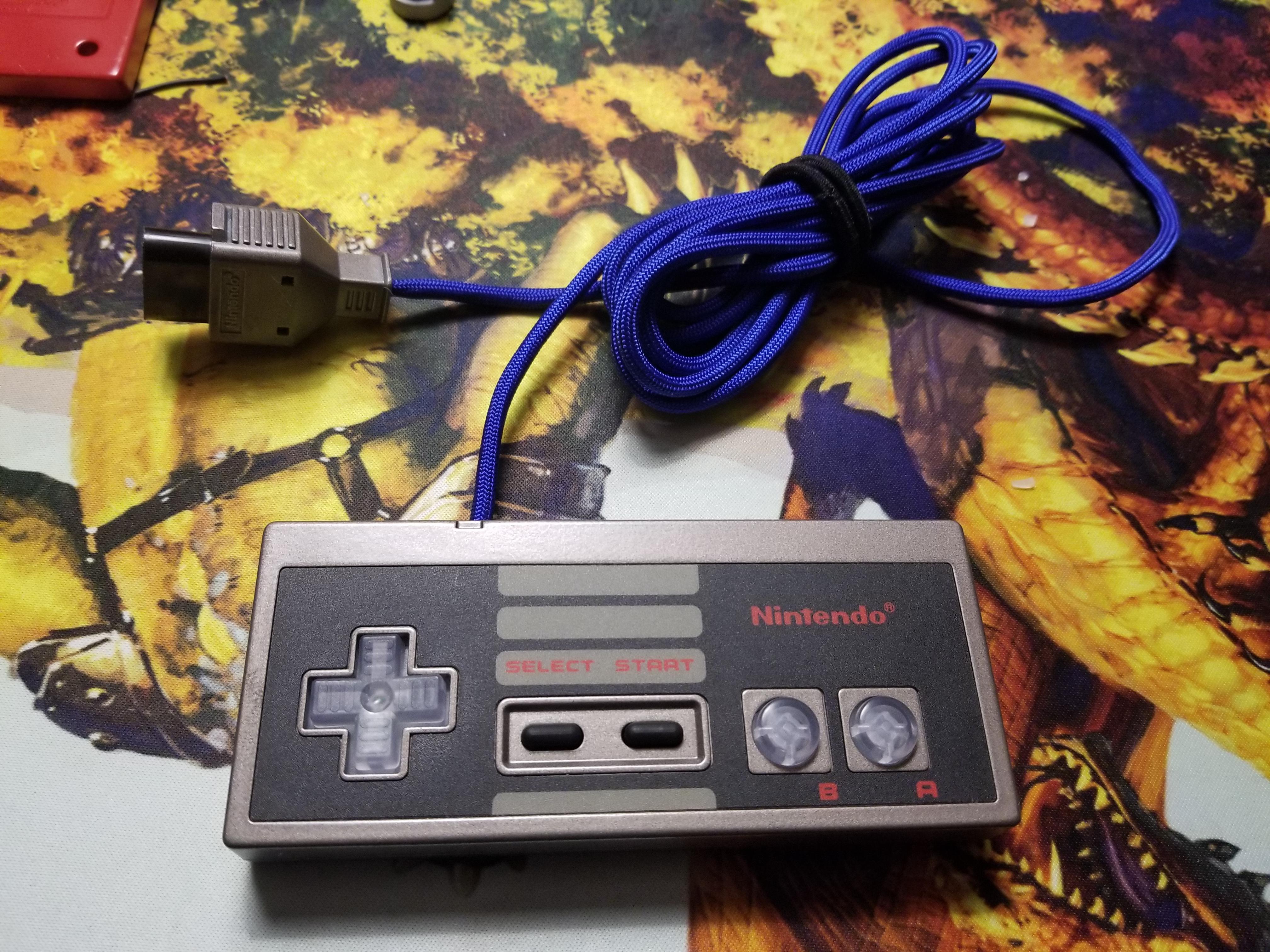 Just finished modding this NES controller! Color changing LEDs and a paracord sleeved cord, what ...