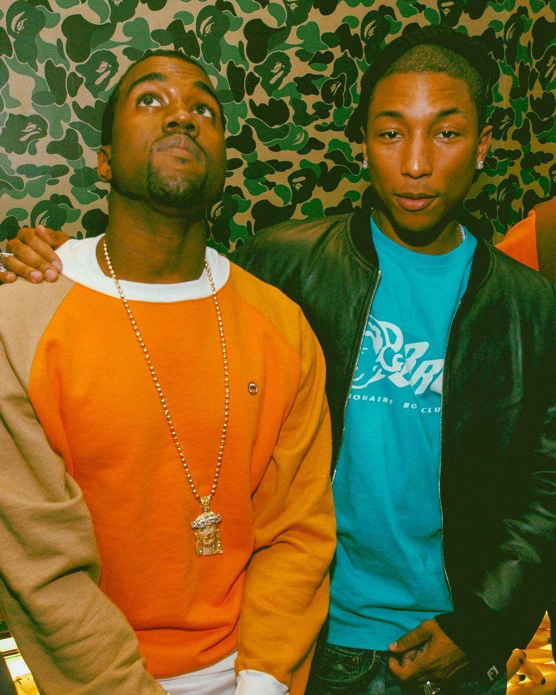 Kanye and Pharrell photographed by Theo Wargo while attending the Bape store opening in NYC ...