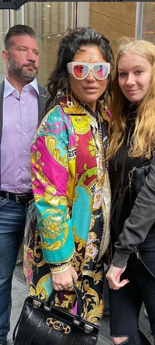 Kesha steps out in Versace and poses with a fan | Scrolller
