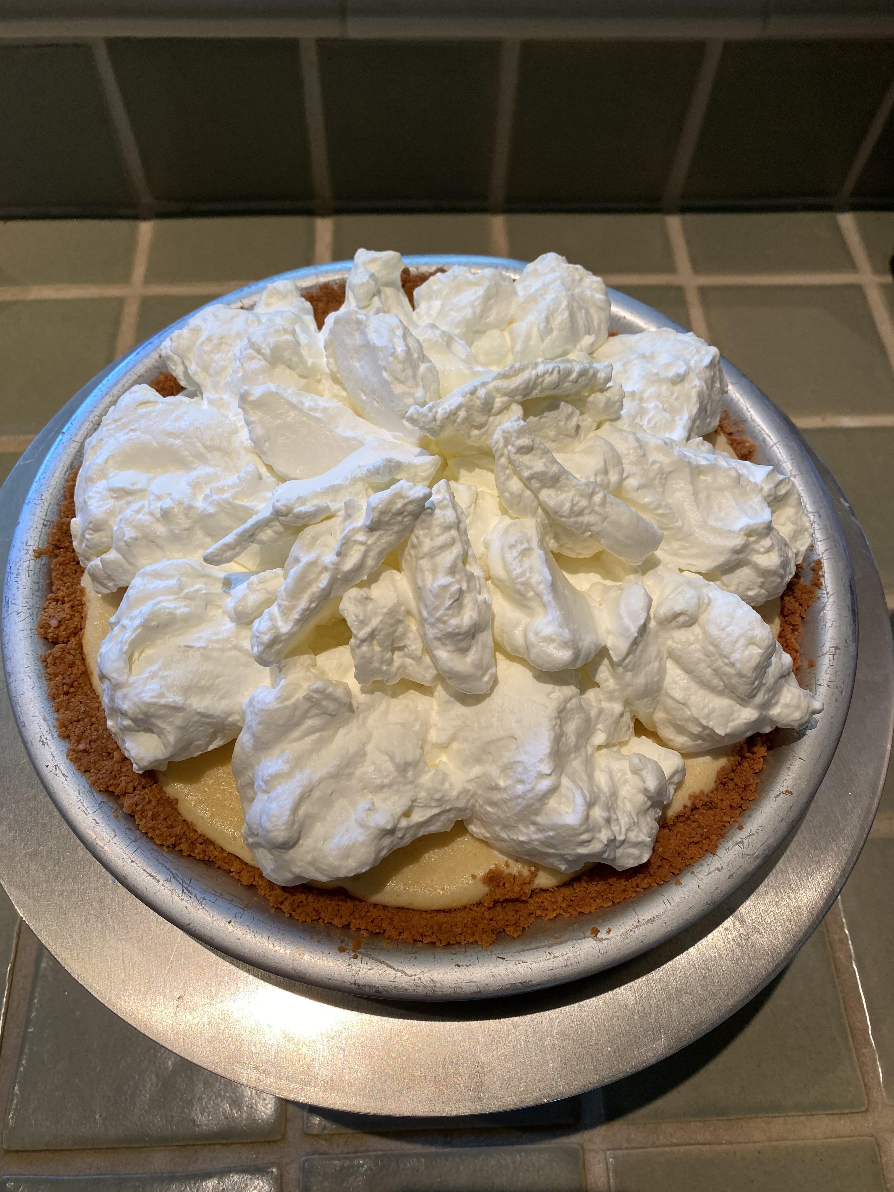Key-Lime Pie with wisps of Whip Cream clouds spooned on top | Scrolller