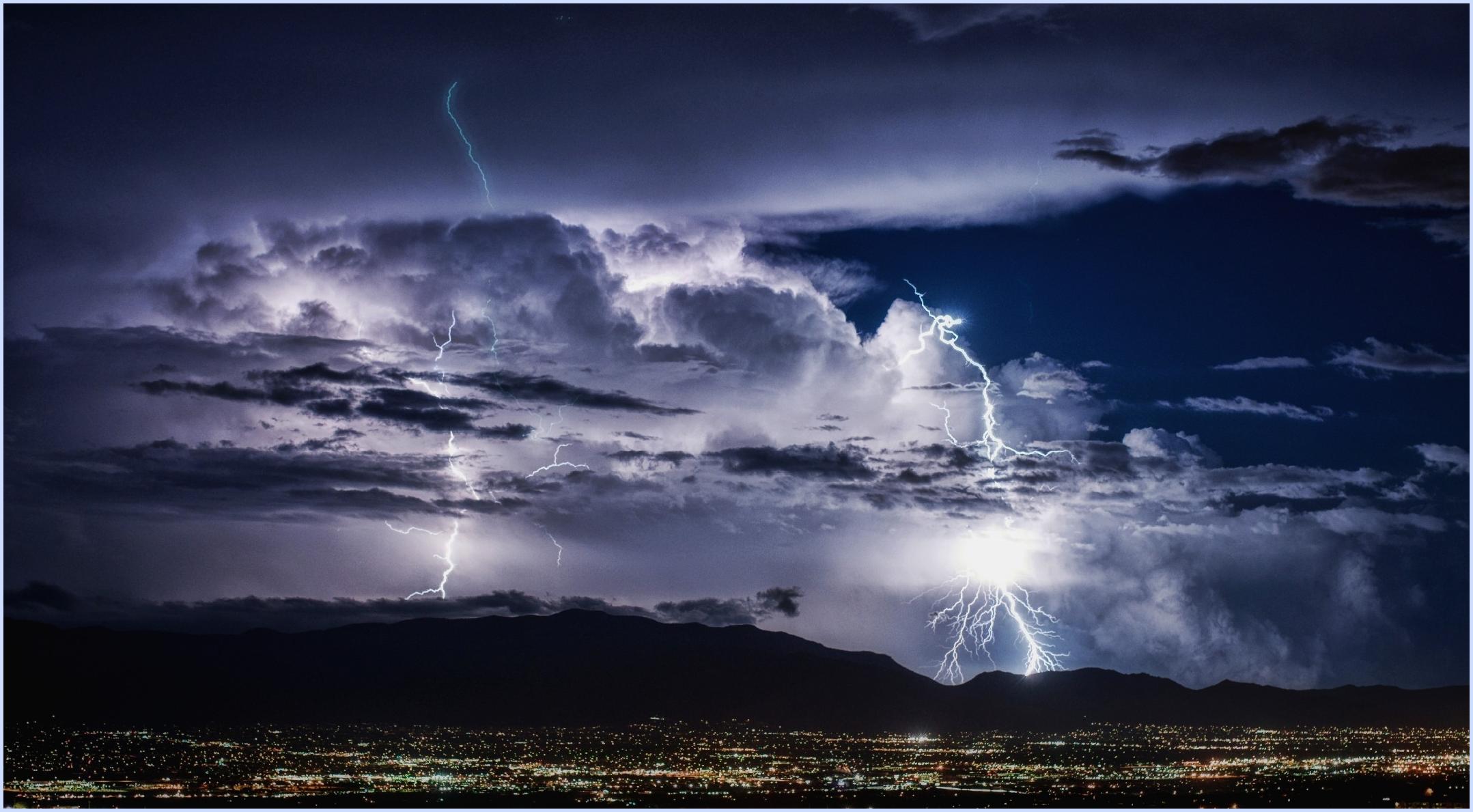 Lightning lights up the night skies revealing thunderstorms east of the Sandia Mountains. 🕊️ ...