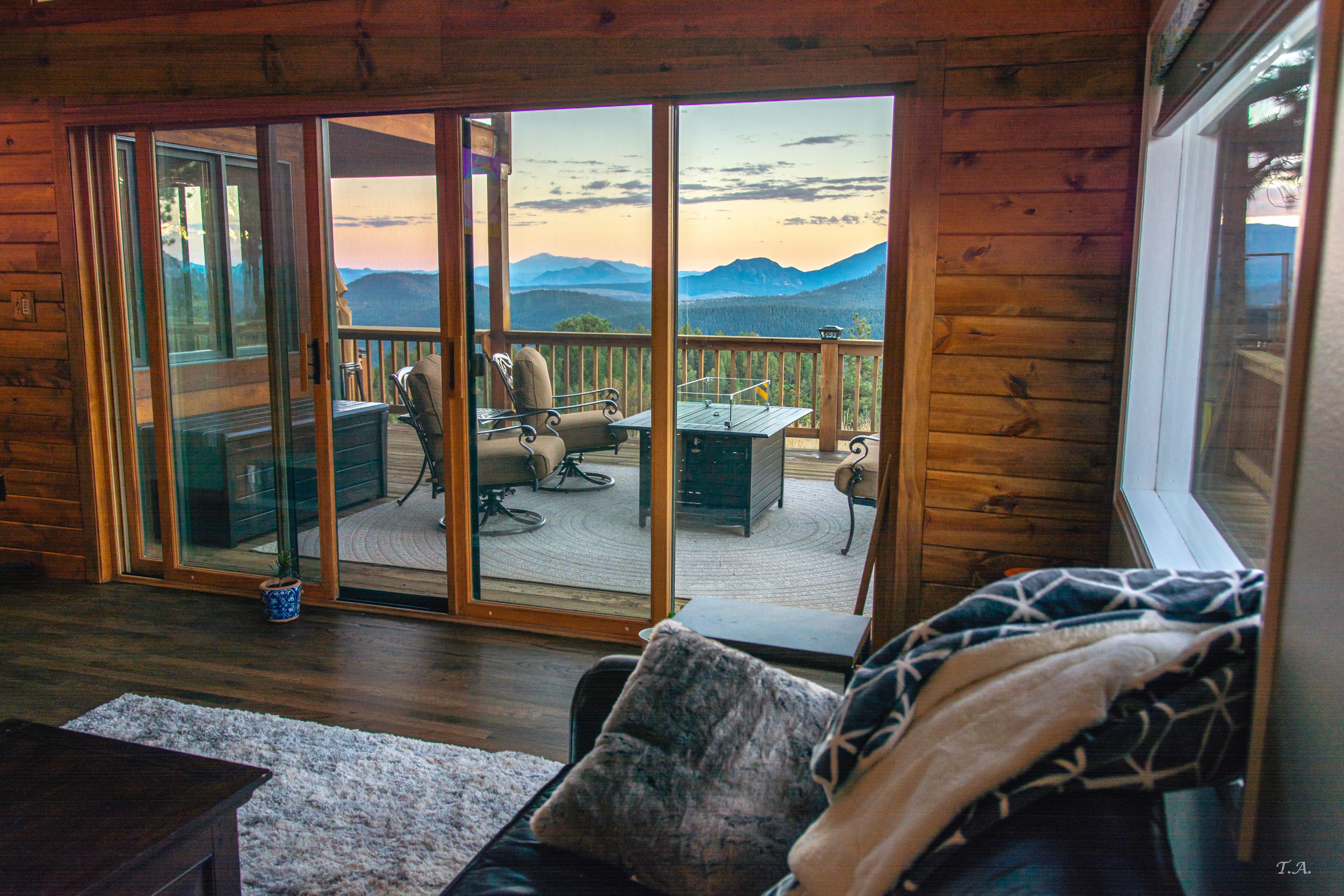 Living room opening to deck and views of The Rockies [3840x2560] [OC] | Scrolller