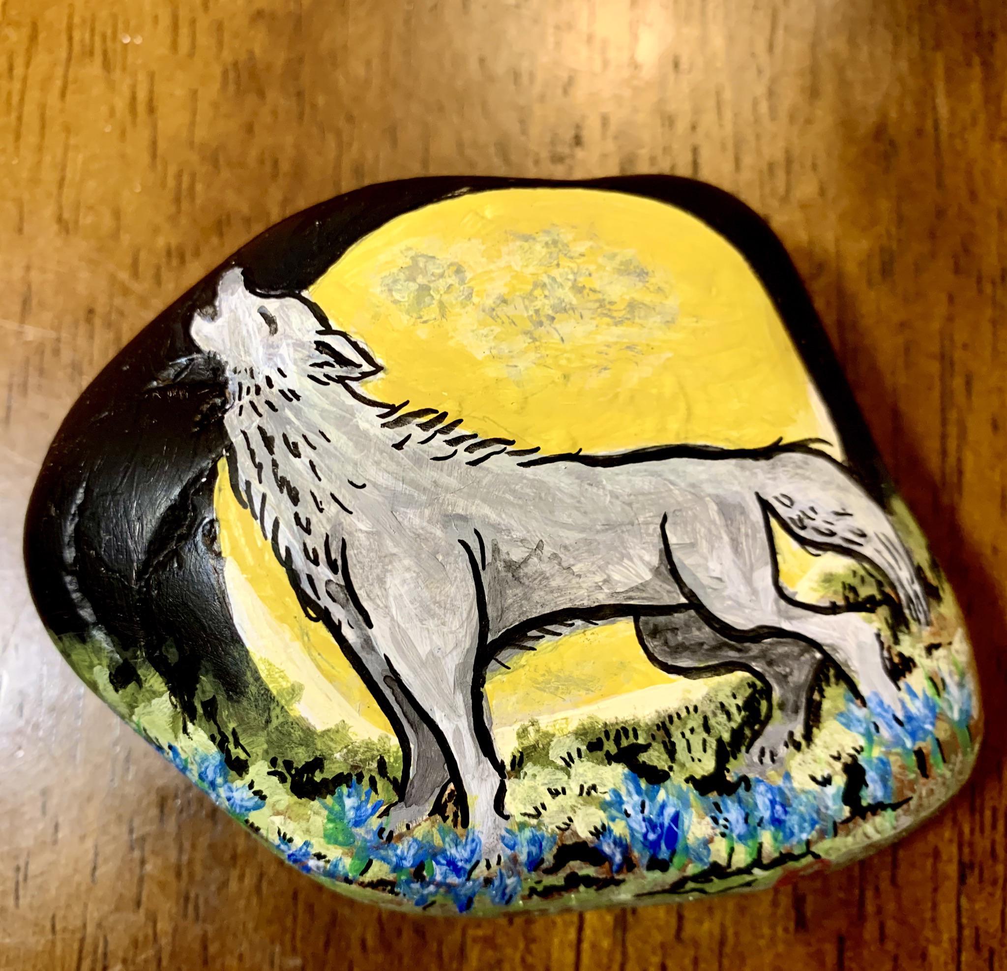 Lone wolf in blue bonnets painted rock by me. | Scrolller