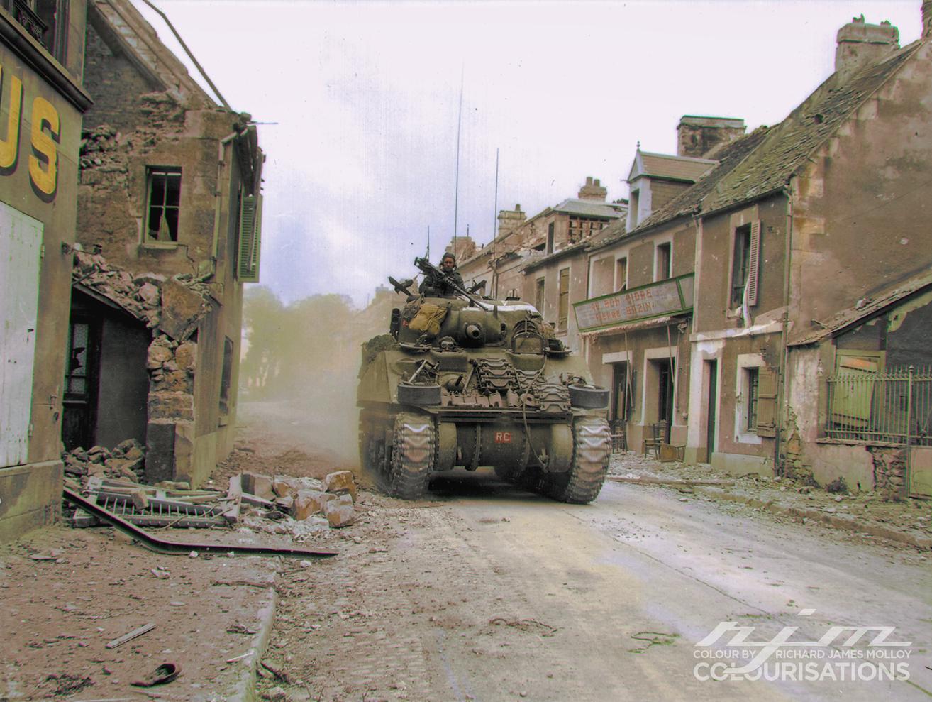 M4 Sherman tanks of the Sherbrooke Fusiliers, 2nd Canadian Armoured Brigade, advancing into Caen ...