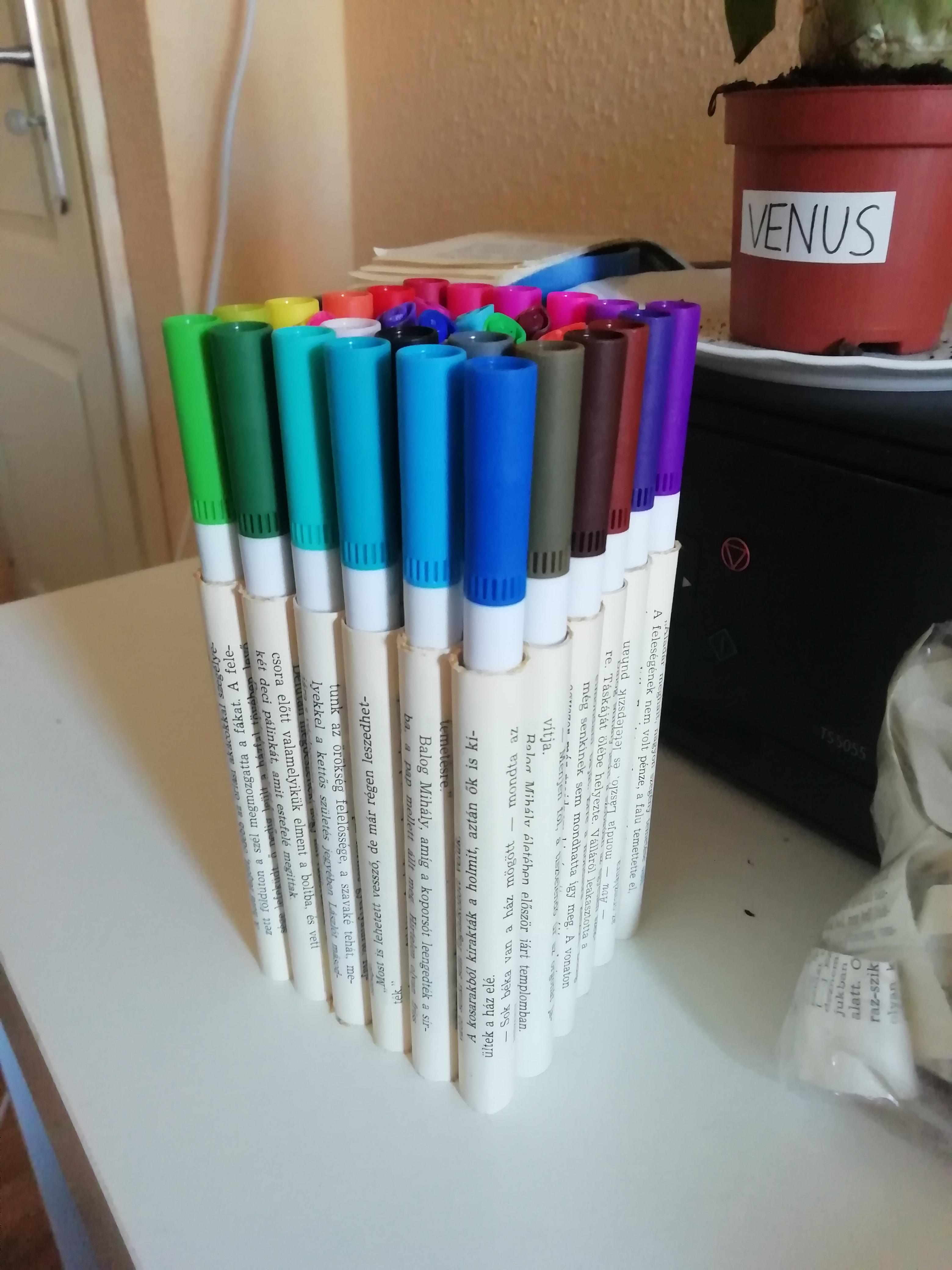 Marker case I made out of rolled up book pages. | Scrolller