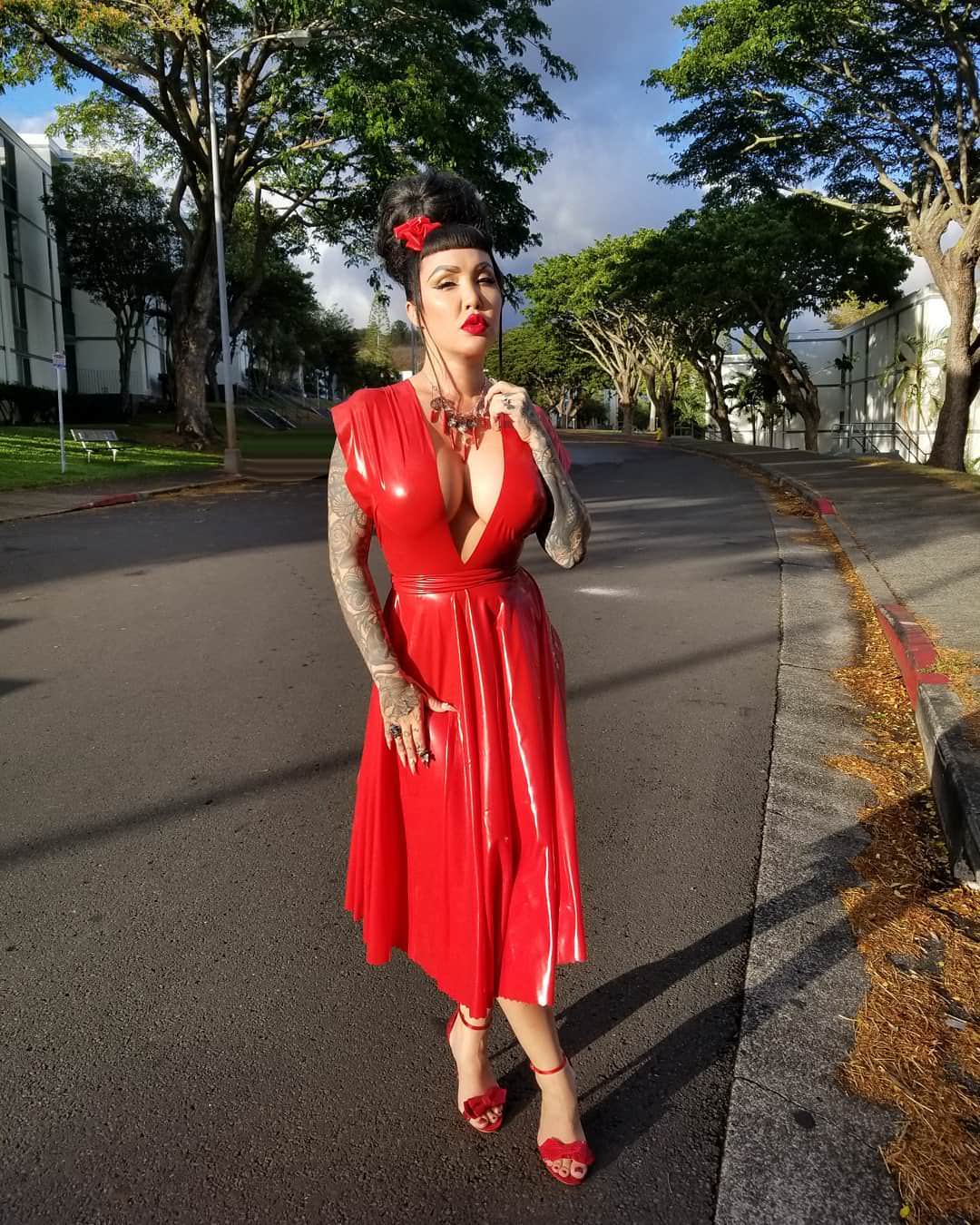 Masuimi Max in a red latex dress | Scrolller