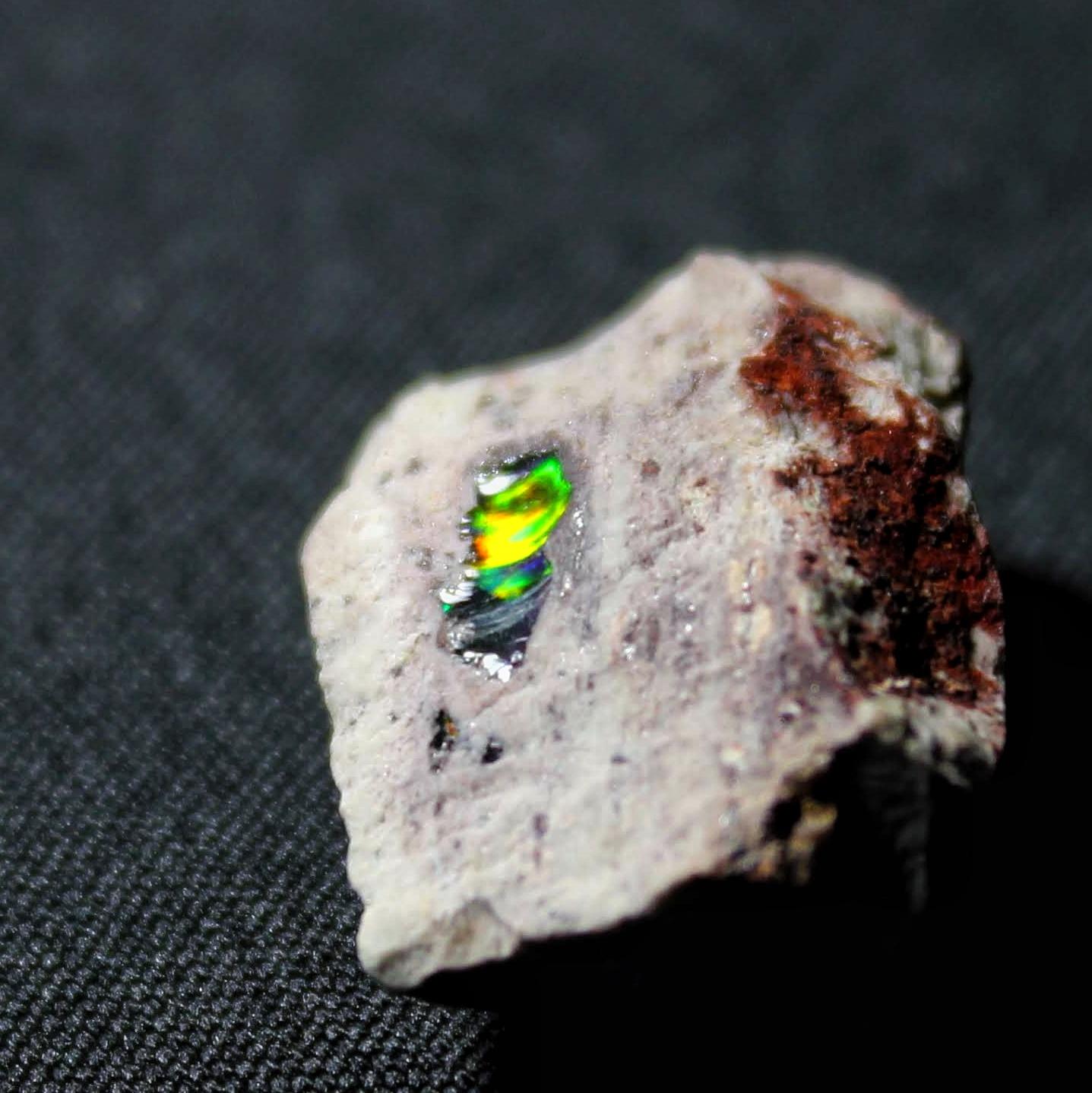 Mexican Fire Opal. Looks like a tiny aurora borealis is trapped inside. | Scrolller