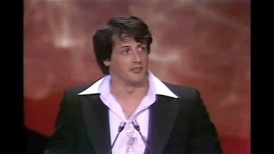 Muhammad Ali surprised Sylvester Stallone onstage at the Oscars, 1977. | Scrolller