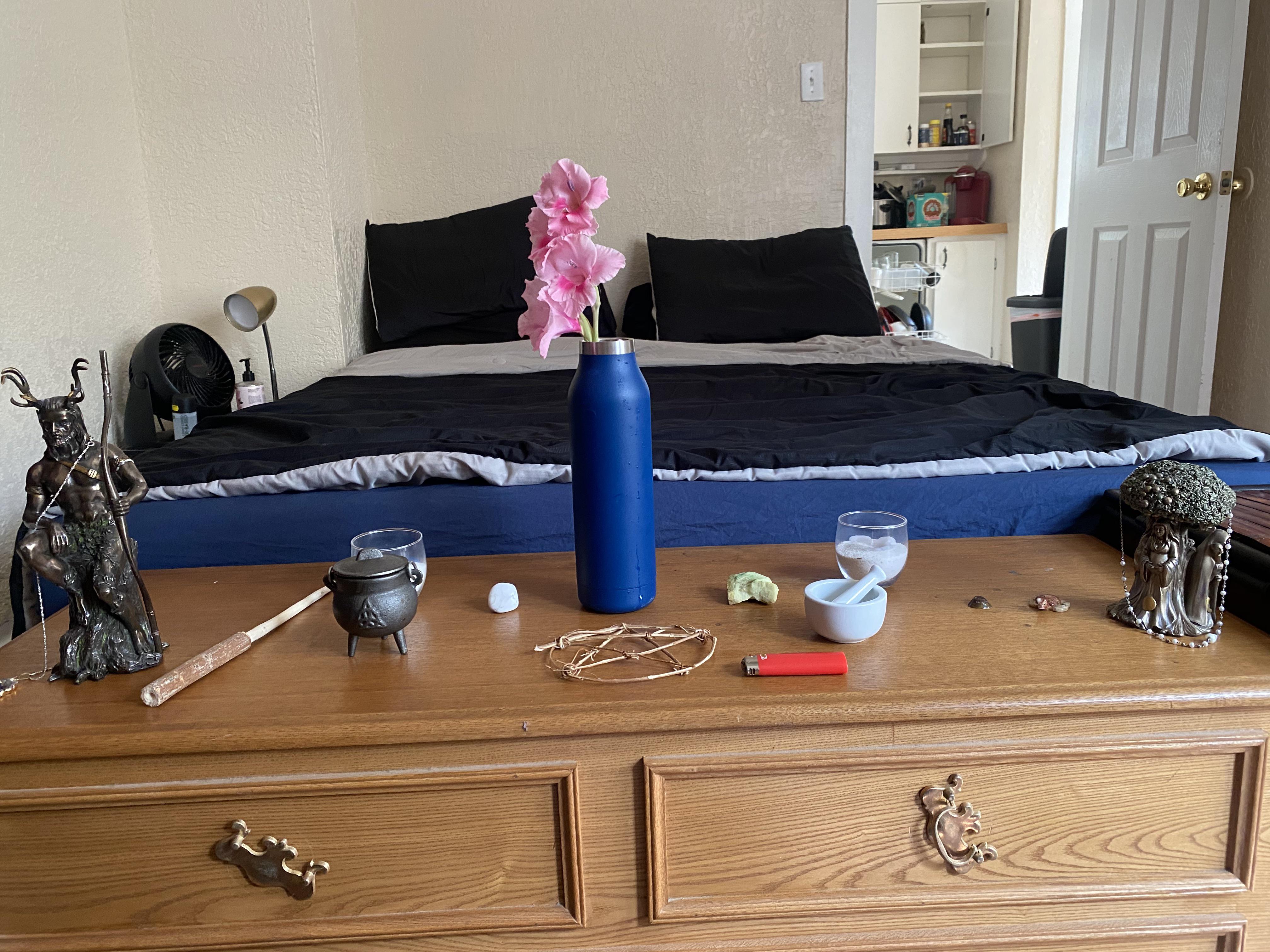 My altar set up! Excuse the bottle for a vase, I’m using all of my vases for plant propagation ...