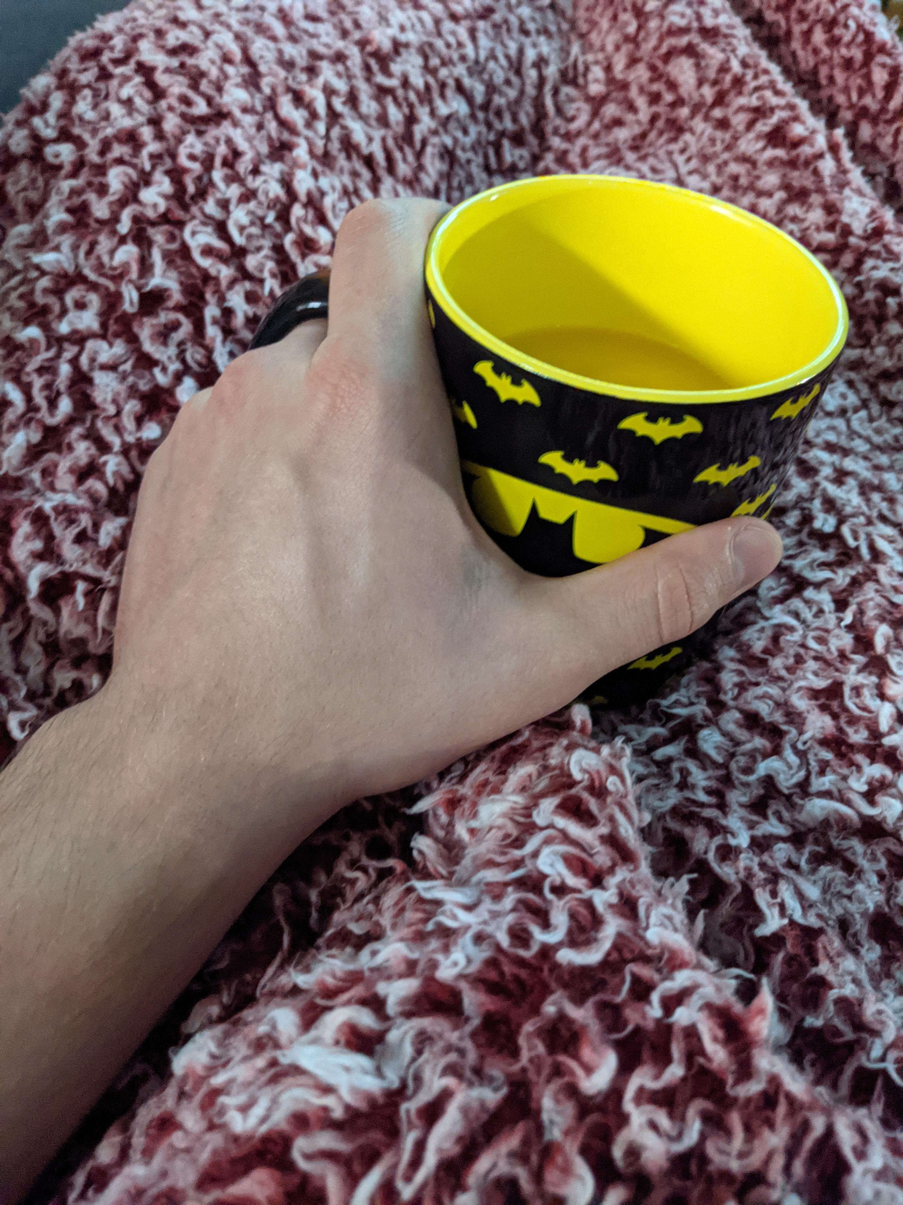 My hand and my cool Batman mug | Scrolller