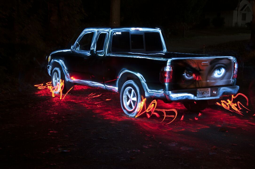 My old truck with my artwork on the tailgate. 4 shots with 2 people and 2 flashlights. | Scrolller