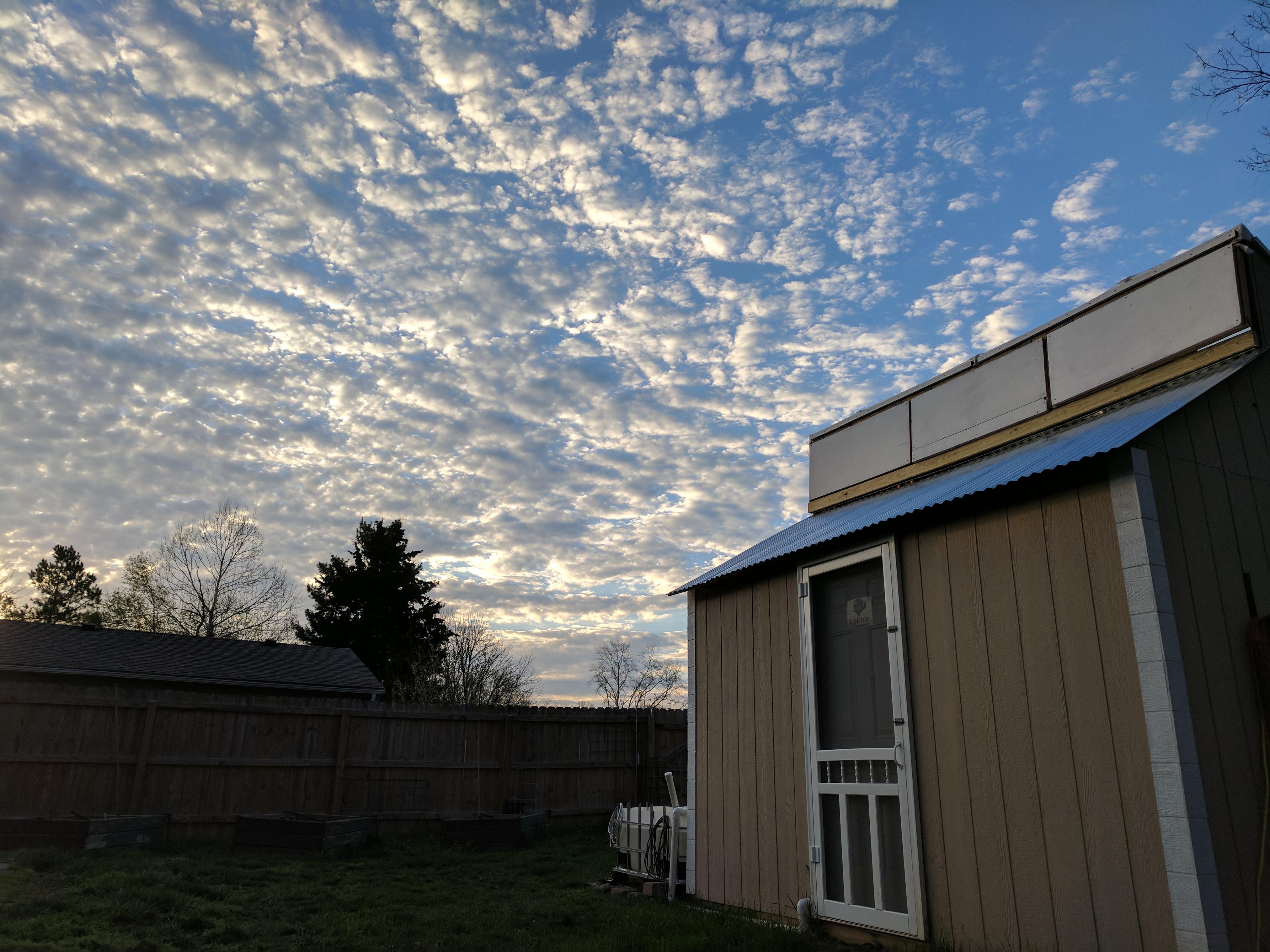 My passive solar greenhouse with some awesome clouds | Scrolller